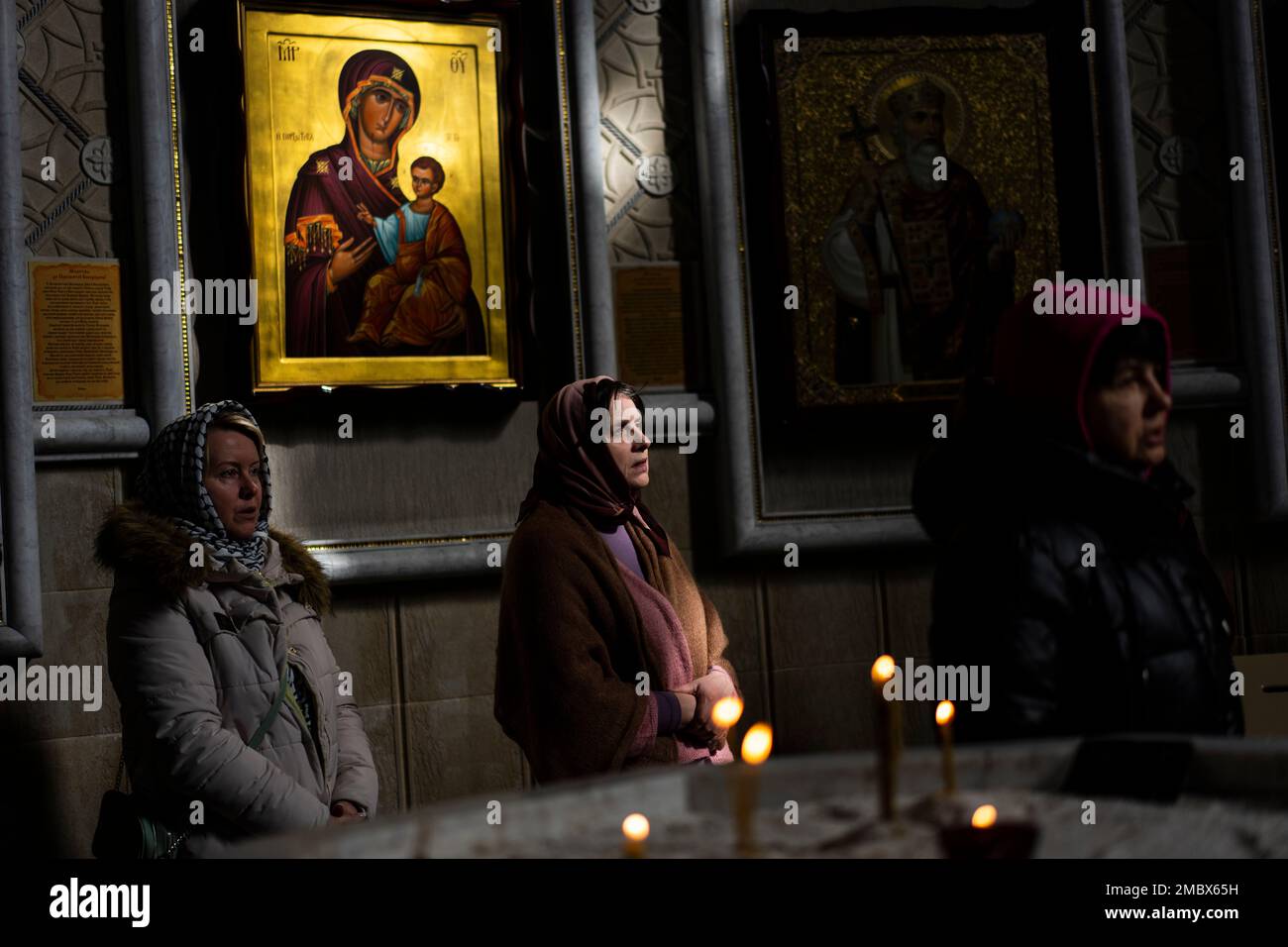 A woman prays inside the "Transfiguration of Jesus" Orthodox Cathedral ...