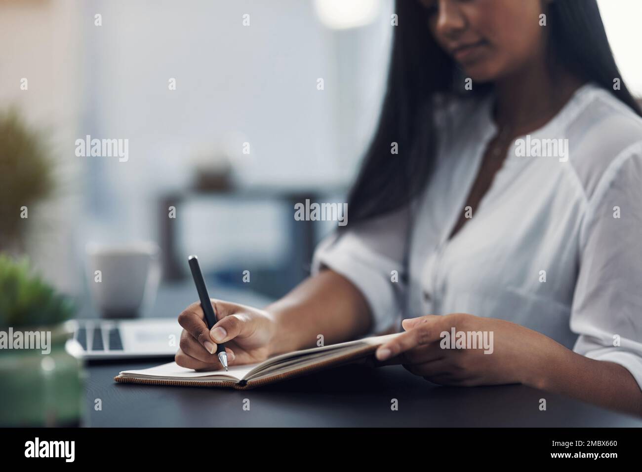 Noting down some big plans. Closeup shot of an unrecognisable woman ...