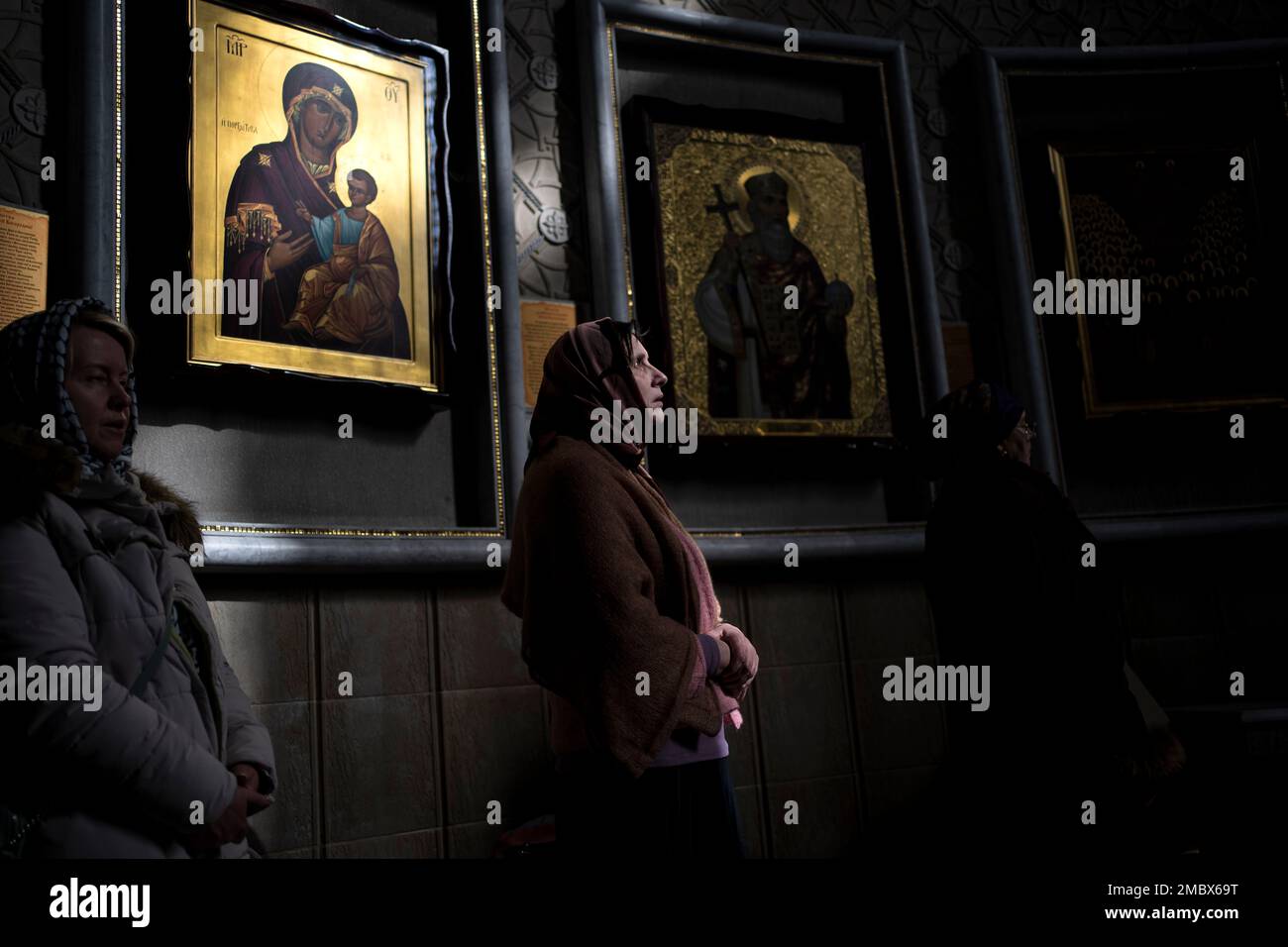A woman prays inside the "Transfiguration of Jesus" Orthodox Cathedral ...