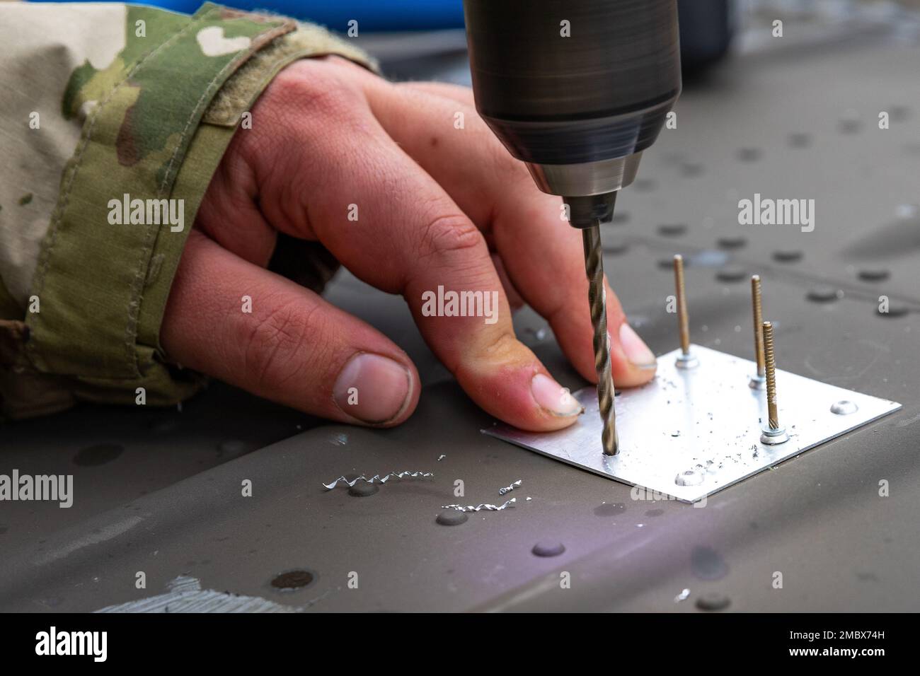 U.S. Army Spc. Owen Johnson, an aircraft structural repairer assigned ...