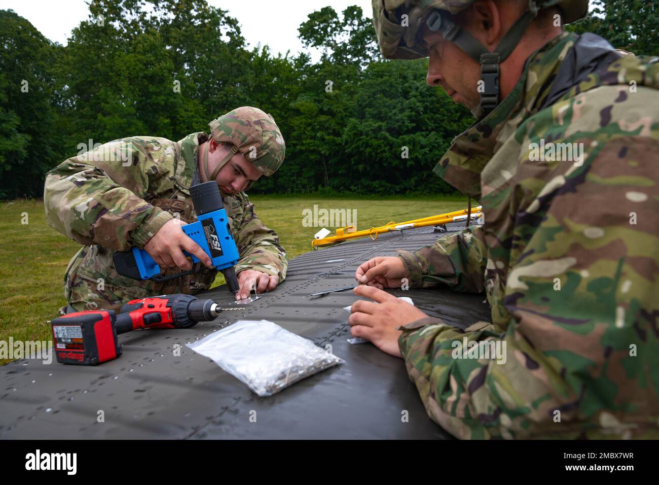 U.S. Army Spc. Owen Johnson, left, and U.S. Army Staff Sgt. David Krug ...
