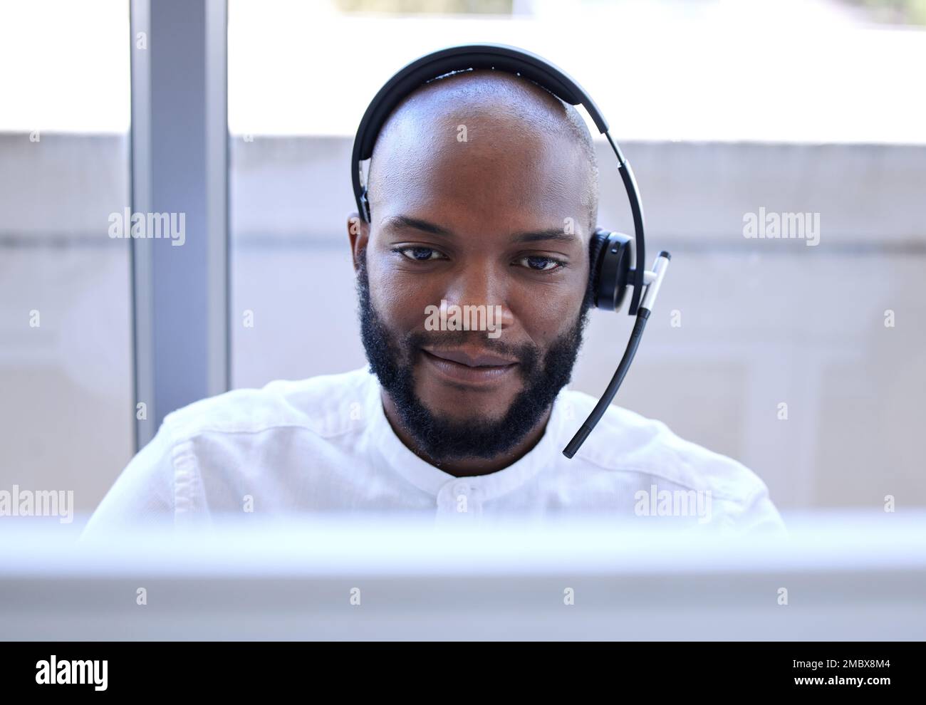 Black man, face and headset in call center, contact us with CRM and ...