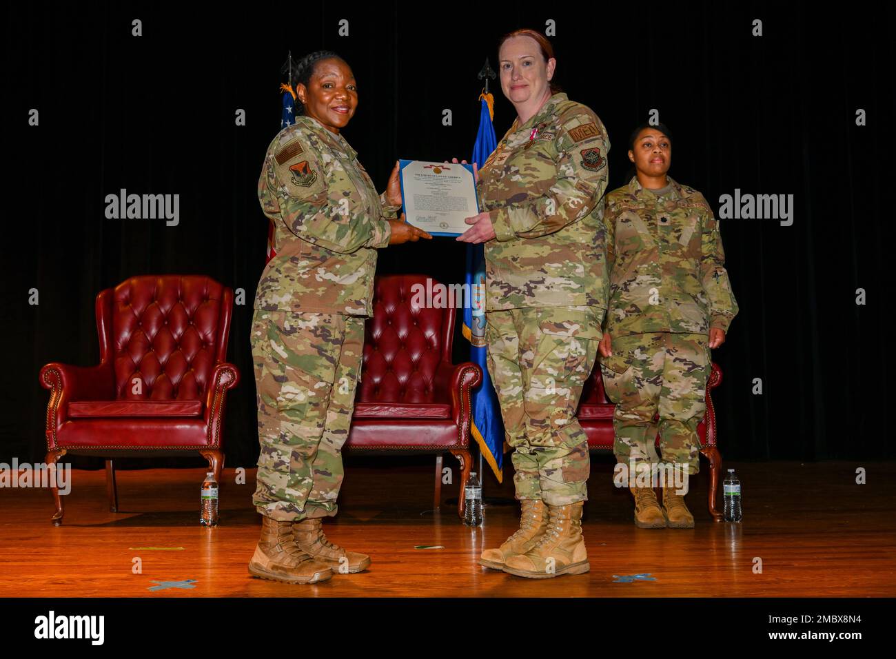 U.S. Air Force Col. Rebecca Elliott, 628th Medical Group commander, presents a Meritorious ...
