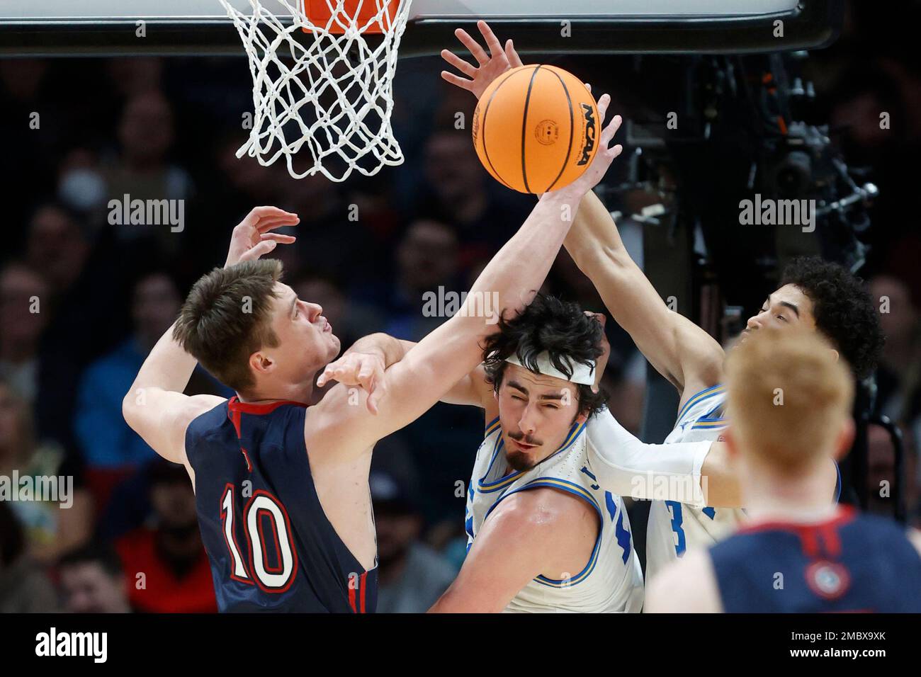 St. Mary's center Mitchell Saxen (10) battles for a rebound with UCLA ...