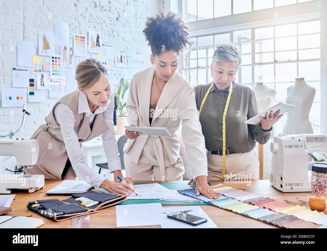 Planning, fashion and designer with business people in workshop studio ...