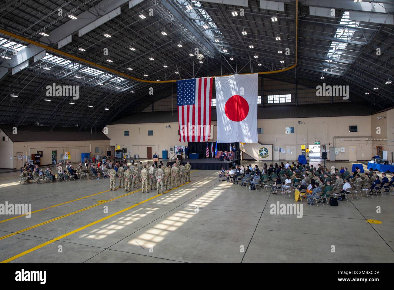 Attendees listen to Col. Andrew Campbell, 374th Airlift Wing commander ...