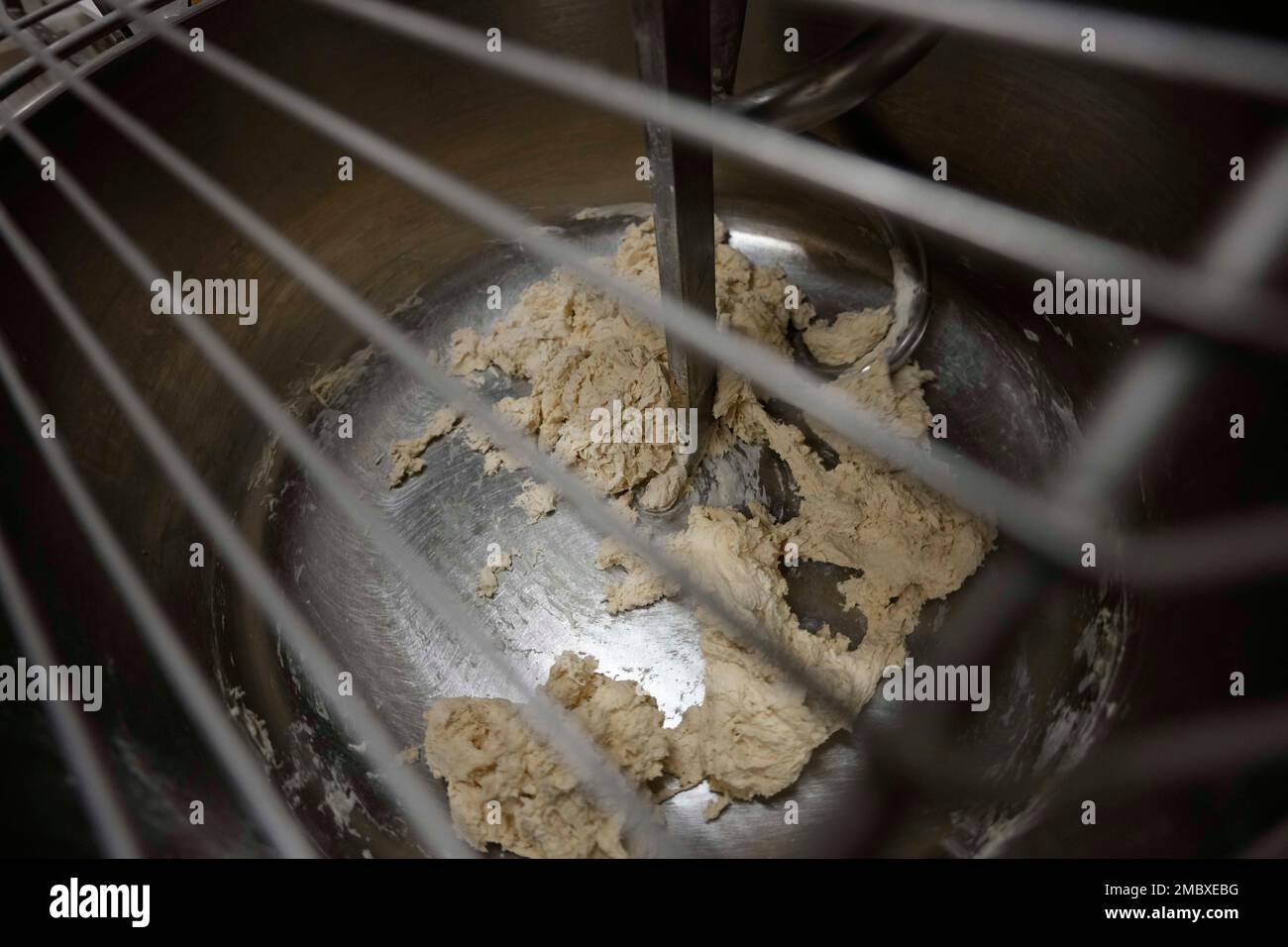 A bread machine is working inside a bakery laboratory in Parabiago ...