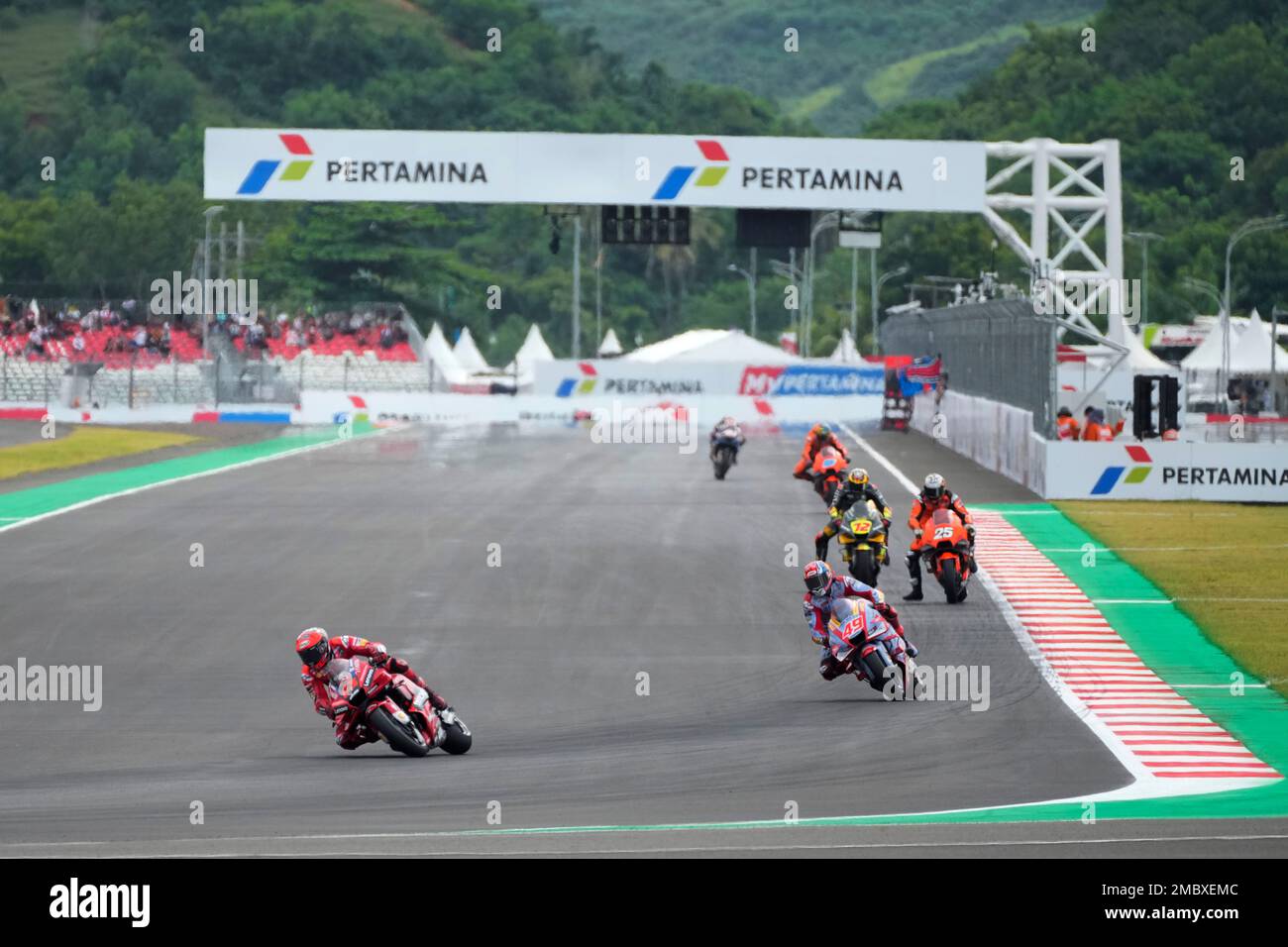 Italian rider Francesco Bagnia of Ducati Lenovo team, left, leans into ...