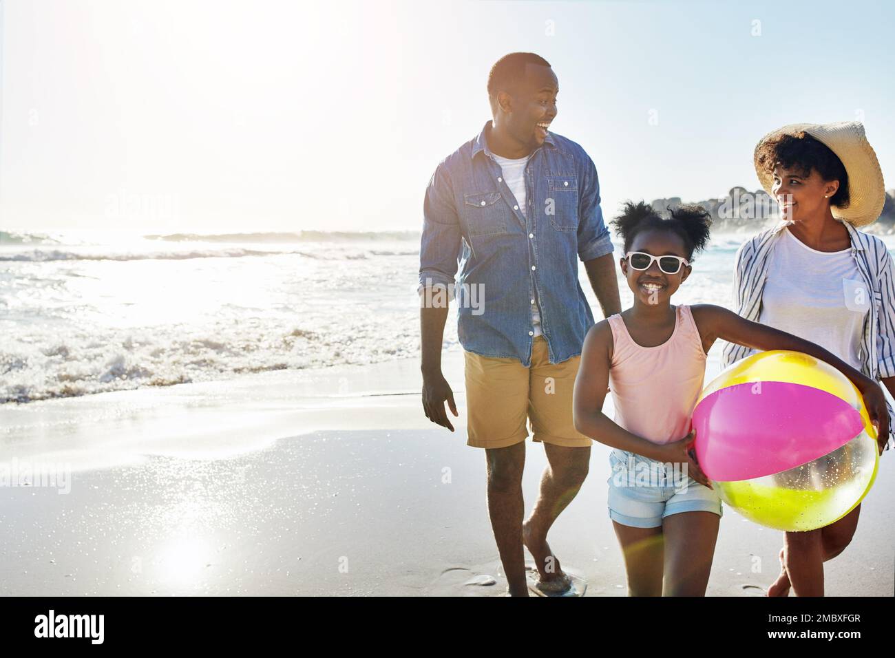 Child carrying ball hi-res stock photography and images - Alamy