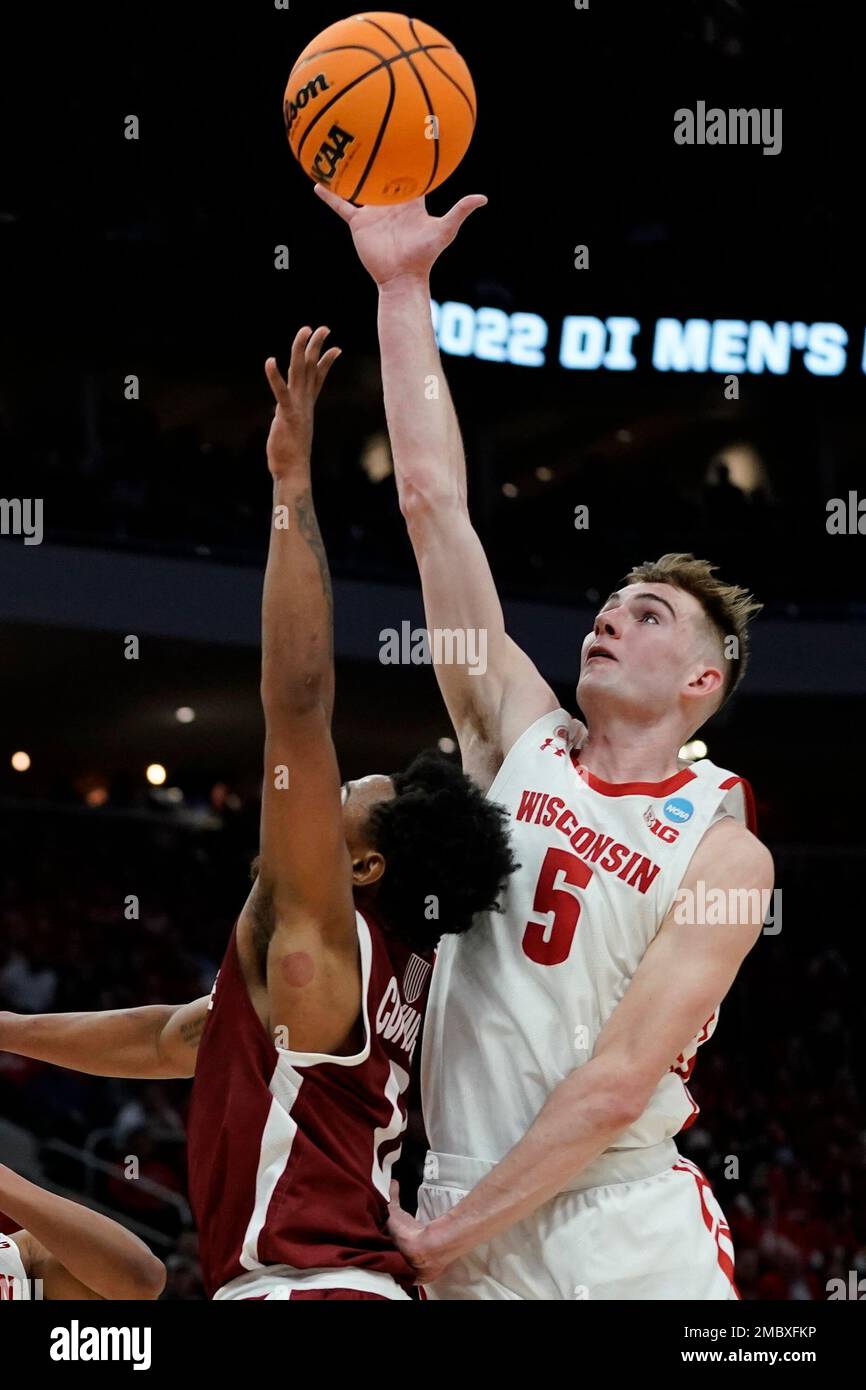 Wisconsin's Tyler Wahl blocks the shot of Colgate's Nelly Cummings ...