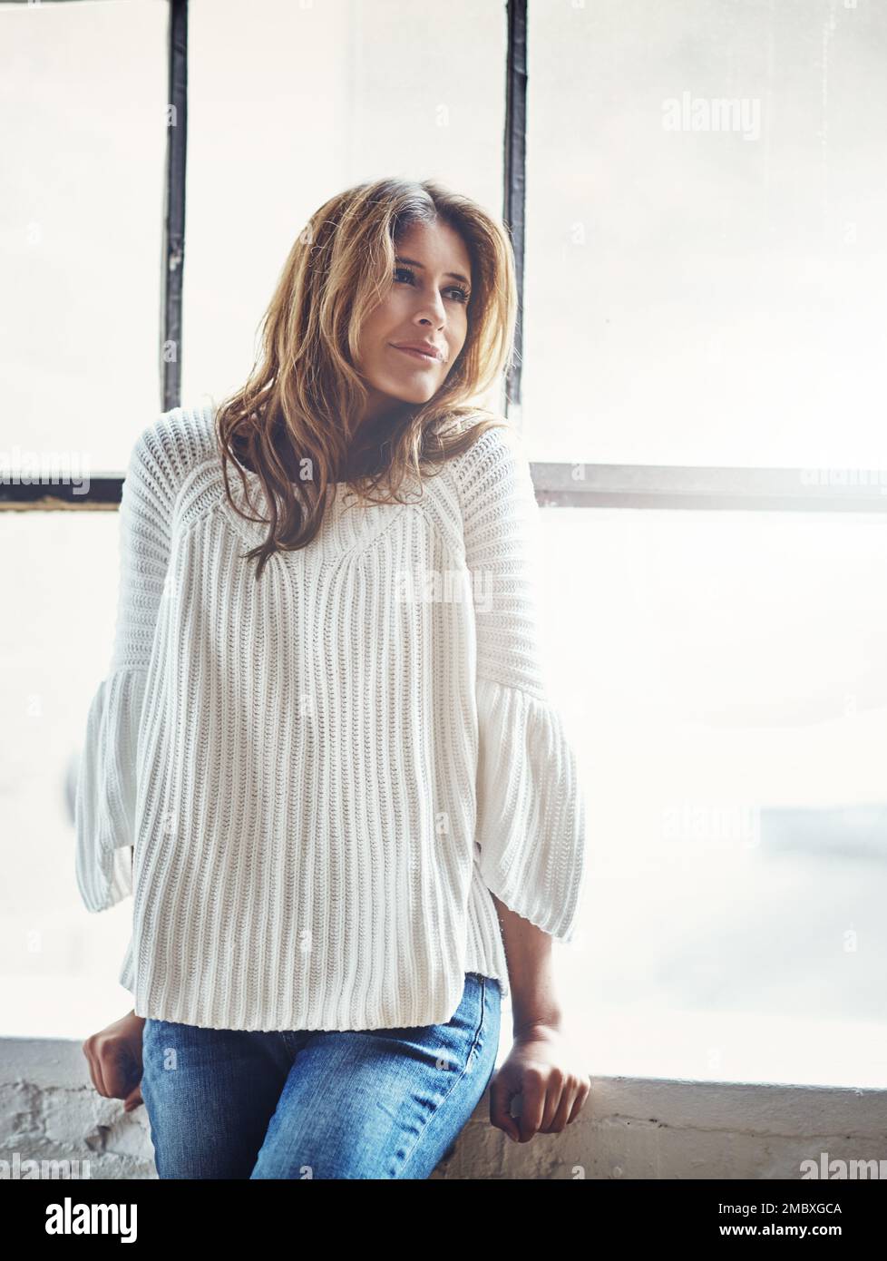 Woman, thinking and relax against window in her home, calm and content ...