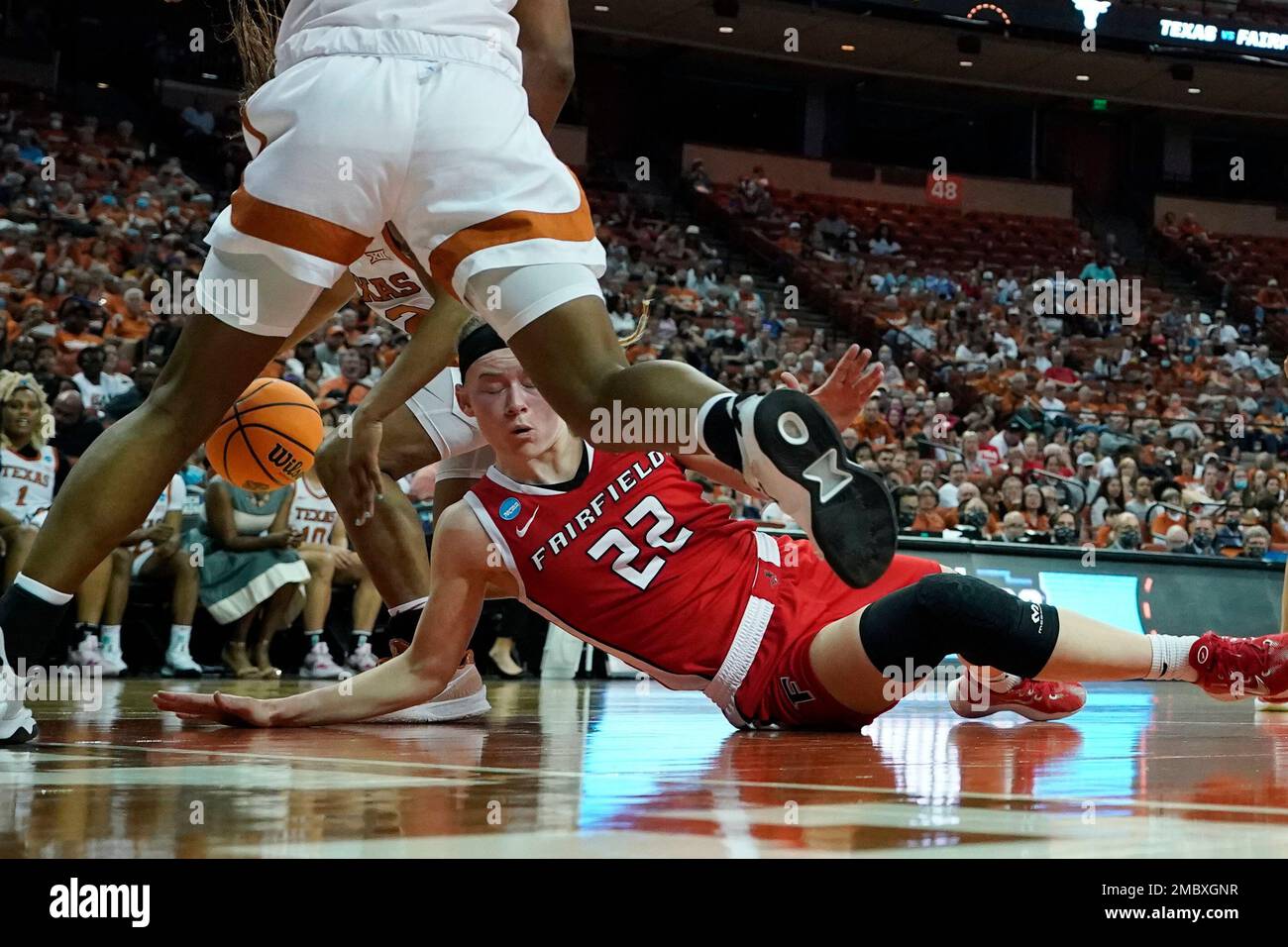 Fairfield guard Rachel Hakes (22) crashes to the floor as she chases a ...