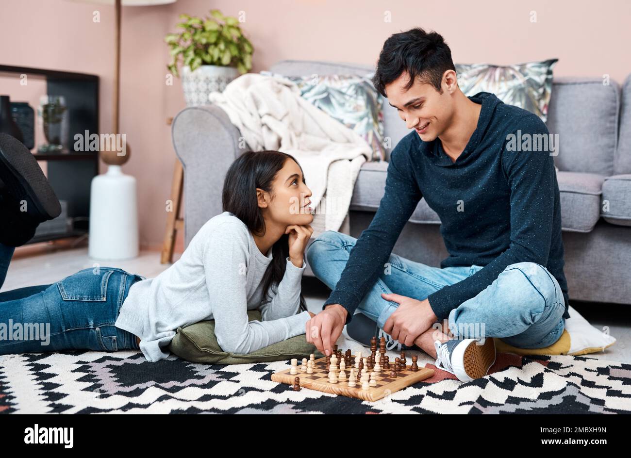 Its all fun and games in self quarantine. a young couple playing a game ...