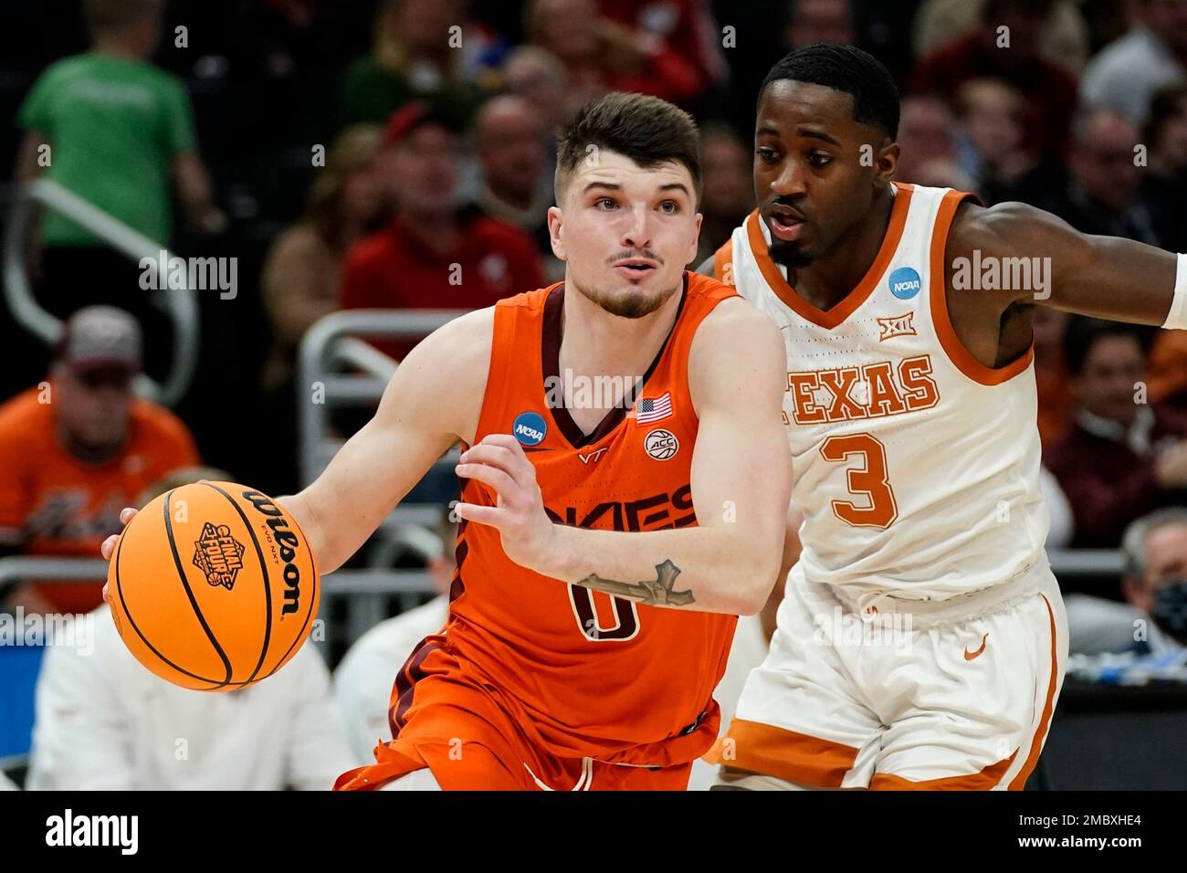 Virginia Tech's Hunter Cattoor drives past Texas's Courtney Ramey ...