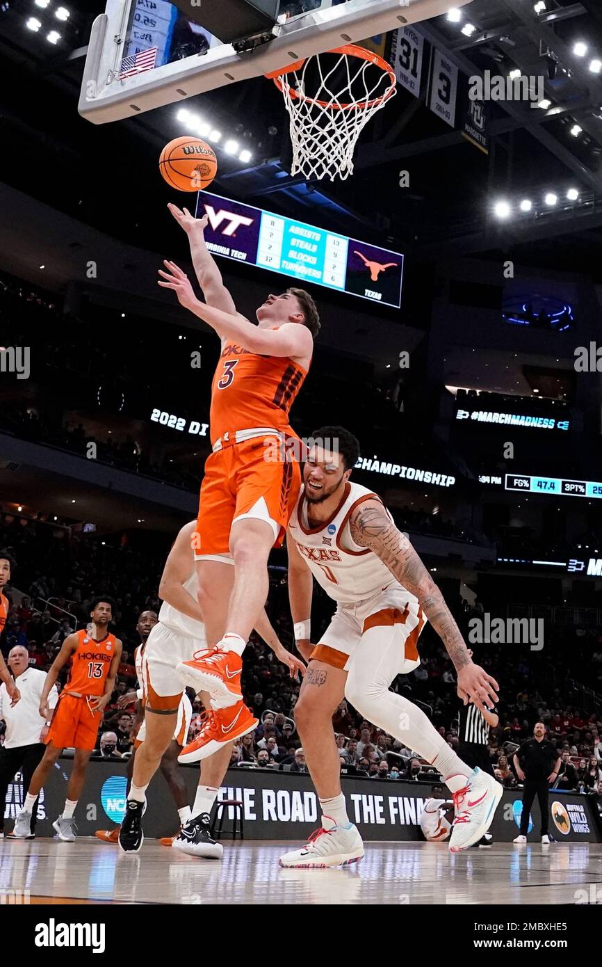 Virginia Tech's Sean Pedulla shoots past Texas's Timmy Allen during the ...