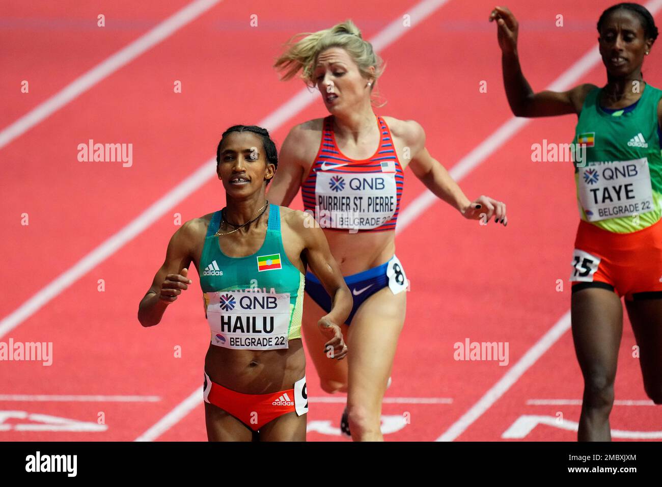 Lemlem Hailu, of Ethiopia, crosses the finish line ahead of Elinor ...