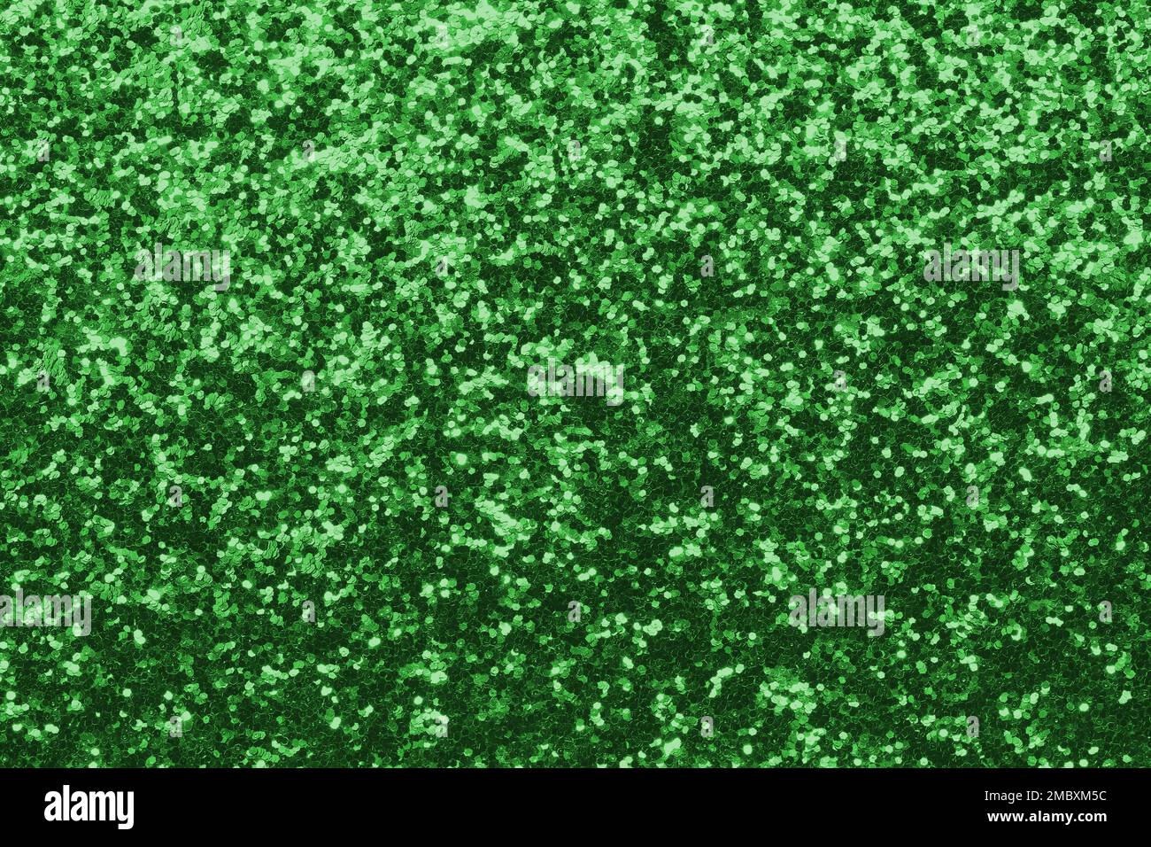 GREEN shimmering glitter material background with glowing effects and ...