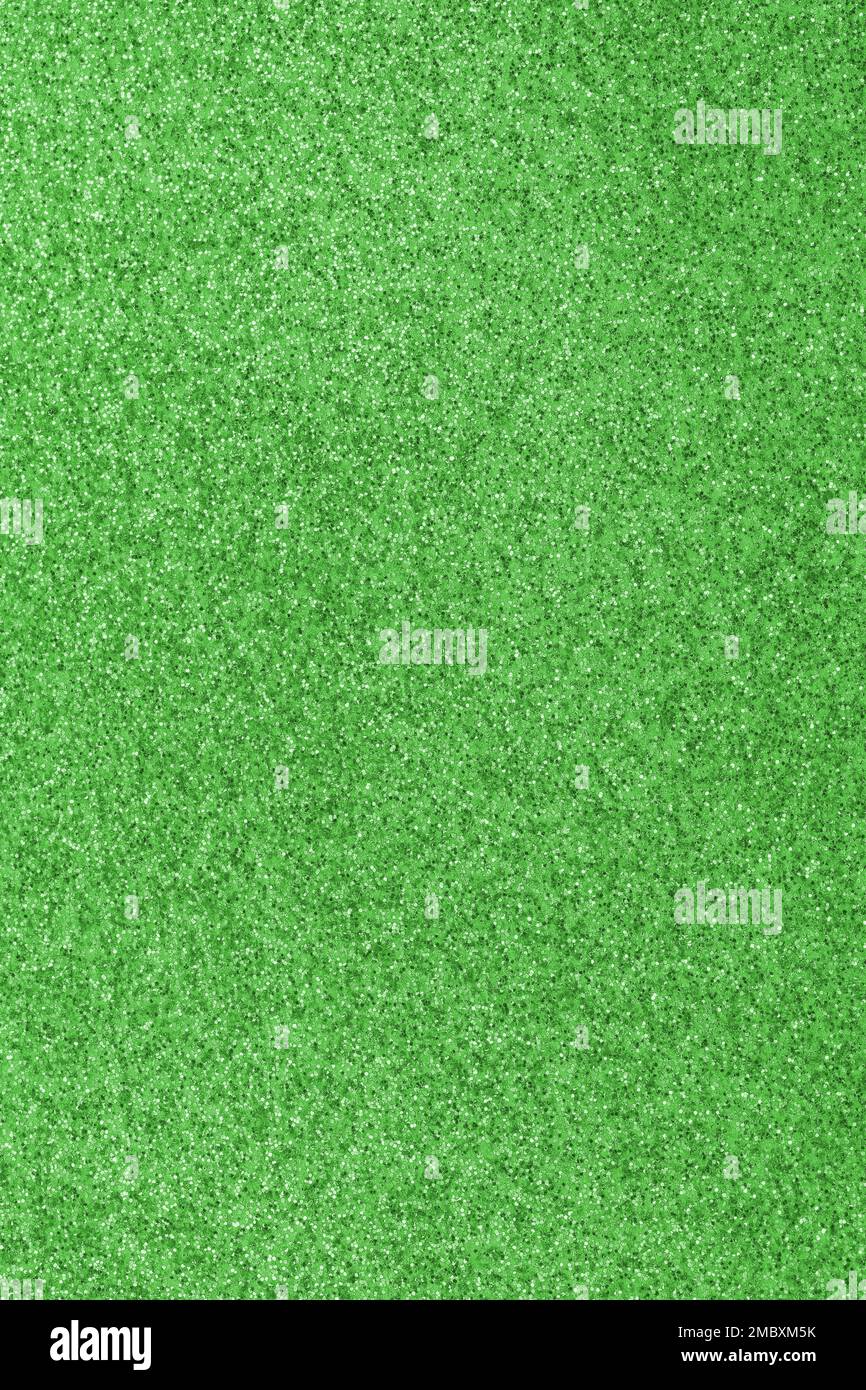 GREEN shimmering glitter material background with glowing effects and ...