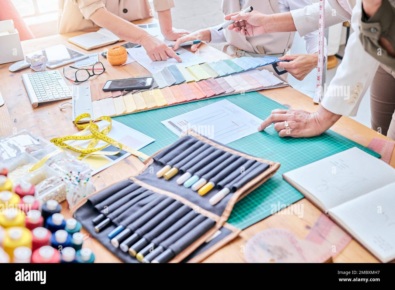 Planning, teamwork and fashion designer hands in creative project ...