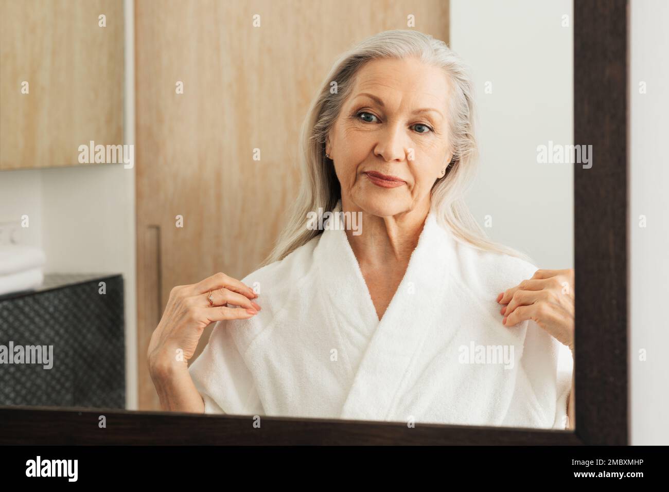 Old woman in bathrobe in hi-res stock photography and images - Alamy