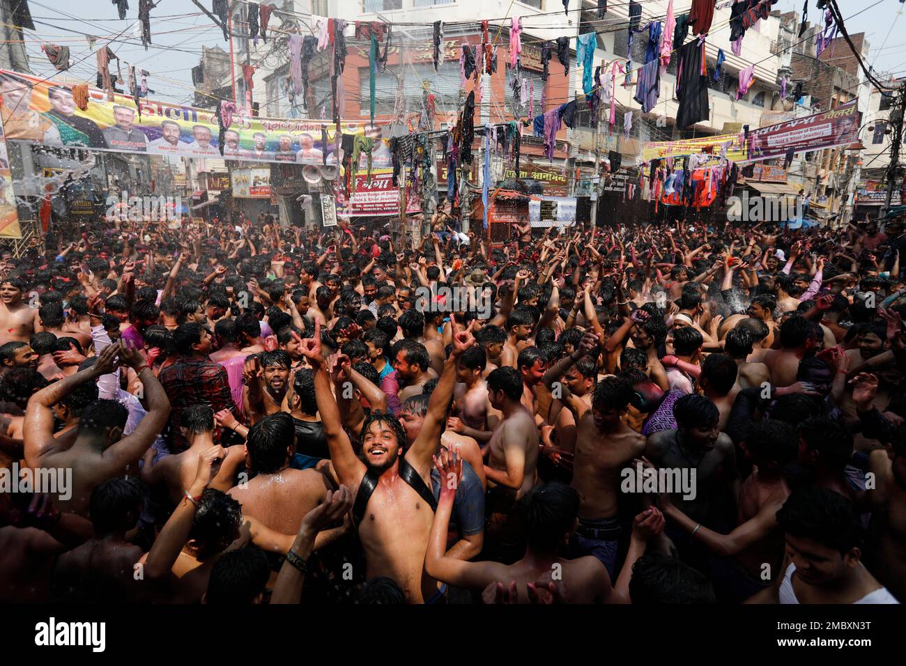 Revellers dance during celebrations to mark Holi in Prayagraj, in the ...