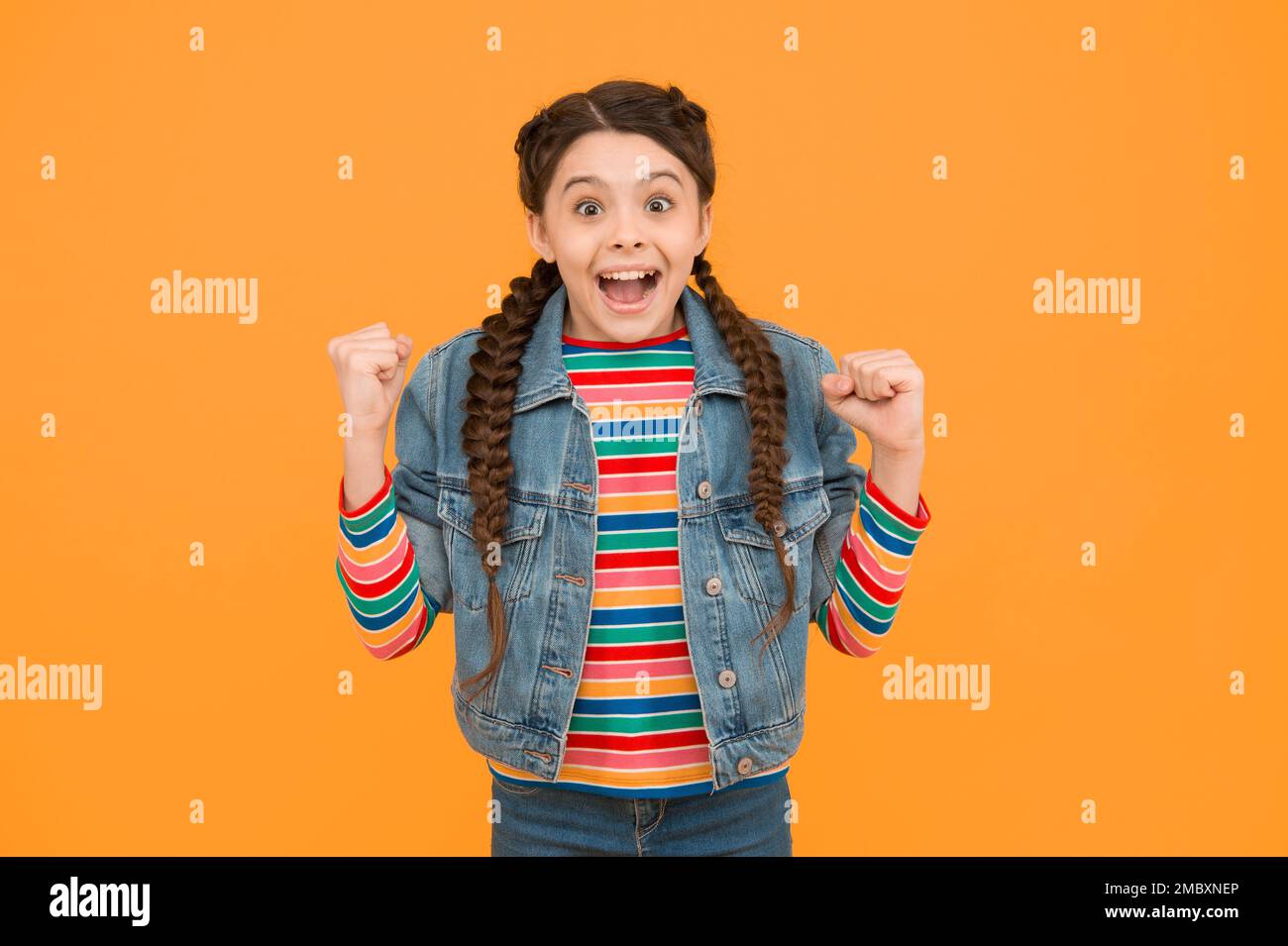 Happy little girl with braids wear denim clothes, excited about sale ...