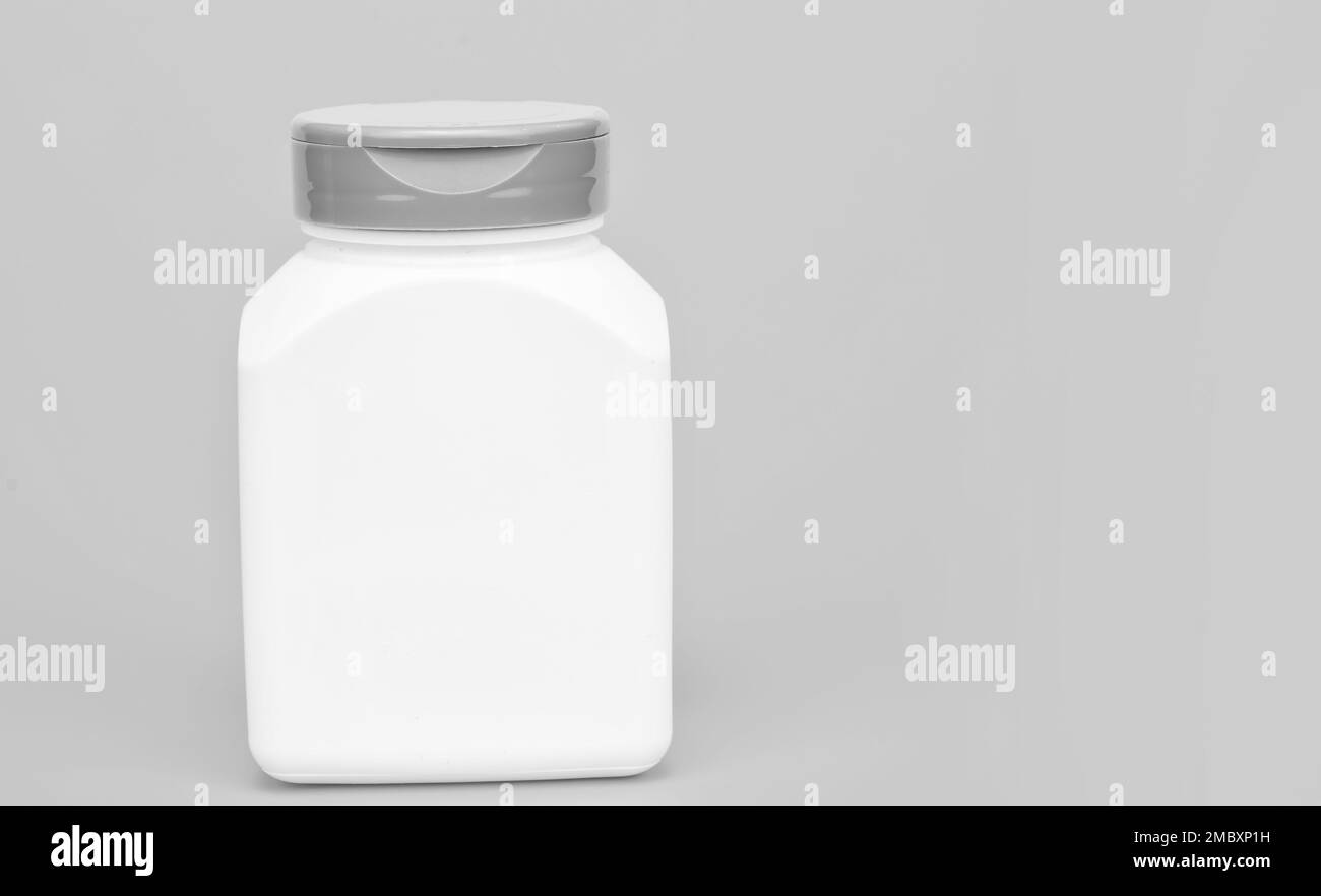 multivitamin bottle on yellow background. copy space. food supplement ...