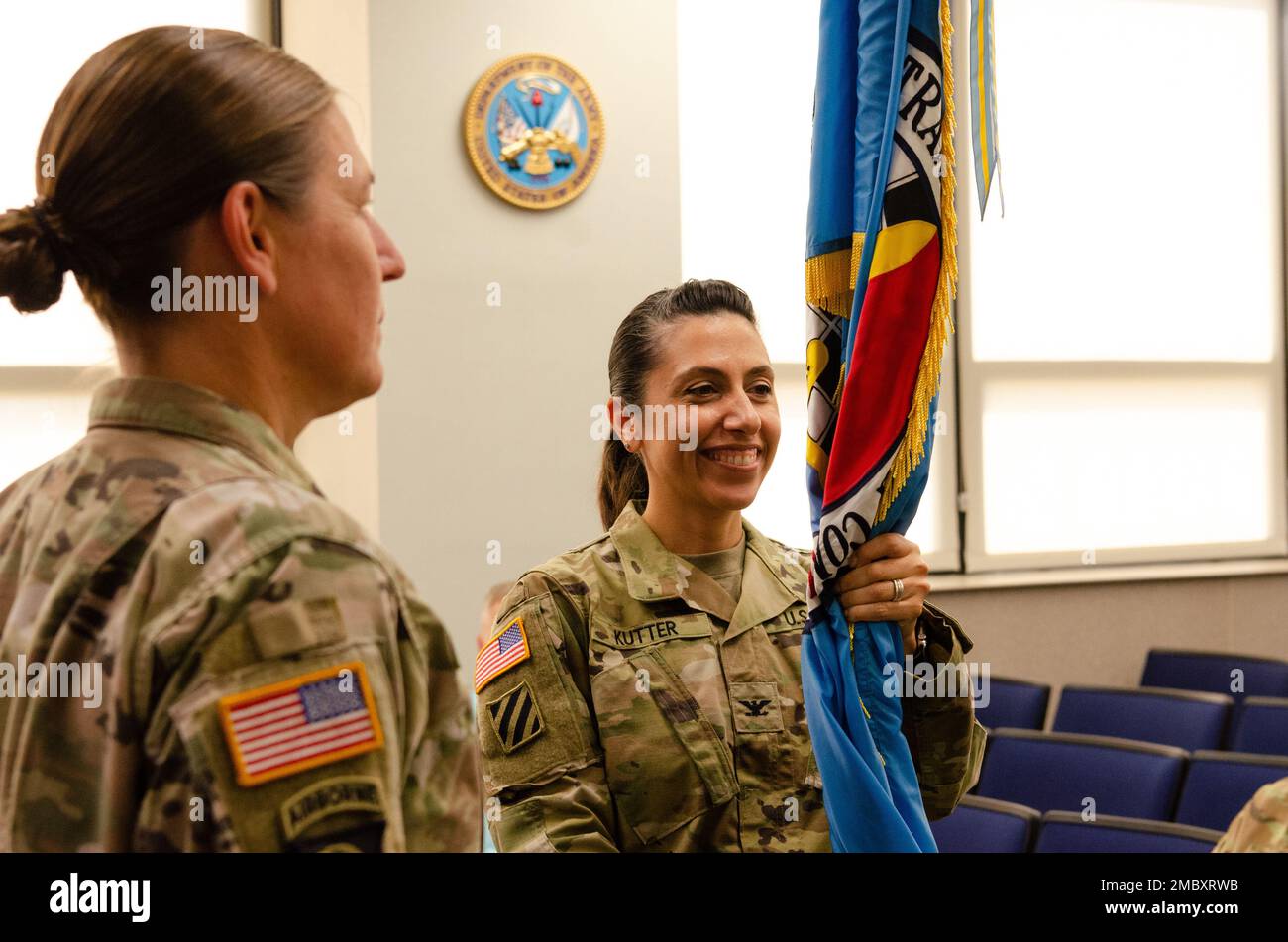 Col. Janelle Kutter, incoming Eastern Sector commander, holds the unit flag during the change of ...