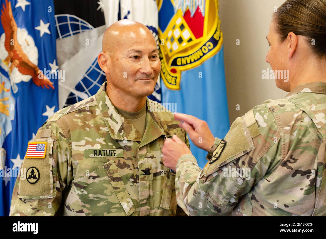 Col. Joe Ratliff, outgoing Eastern Sector commander, receives the ...