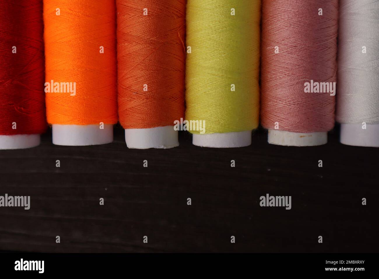 A closeup shot of sewing threads in different colors Stock Photo - Alamy