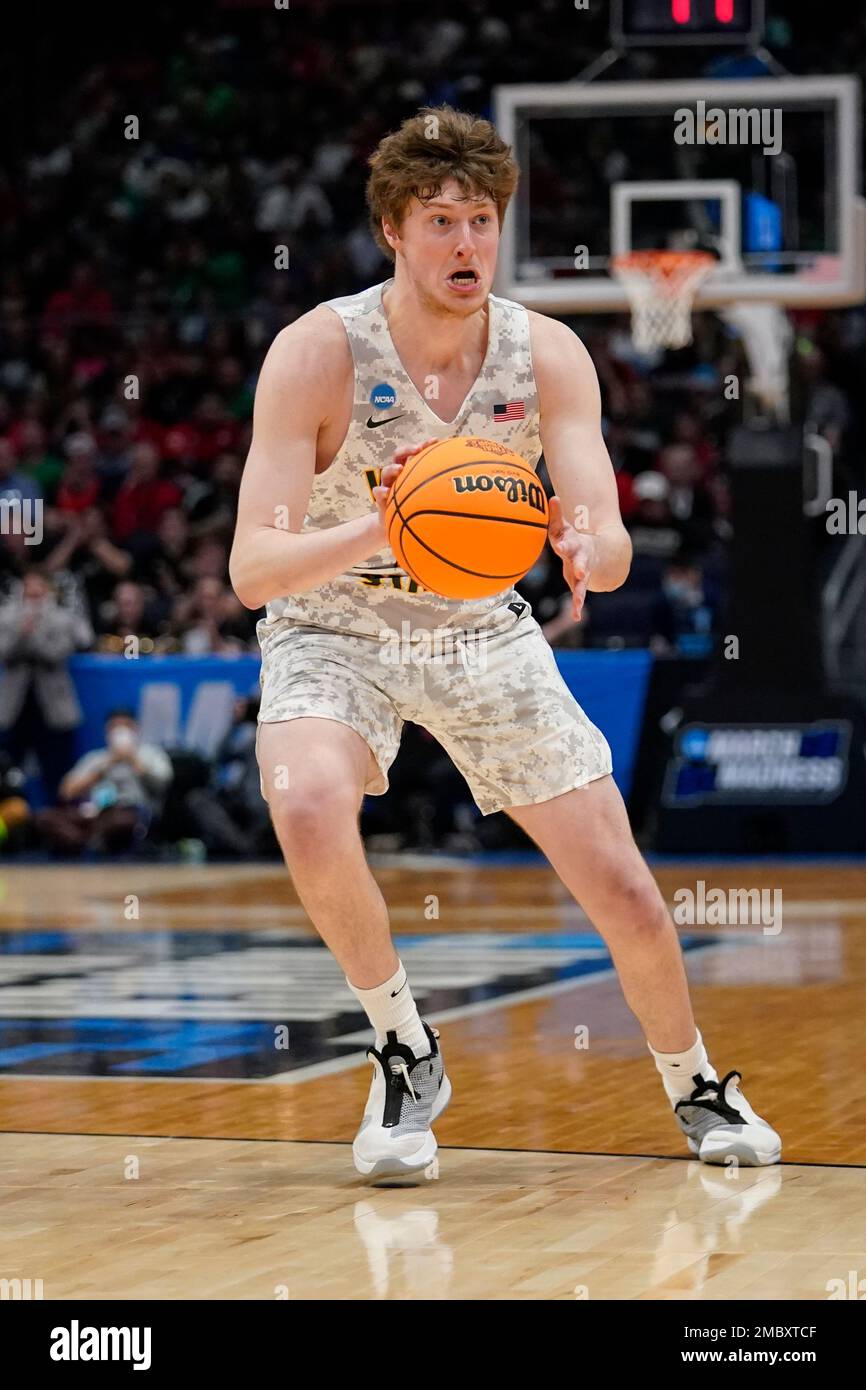 Wright State center AJ Braun, center, passes during the second half of a First Four game in the ...