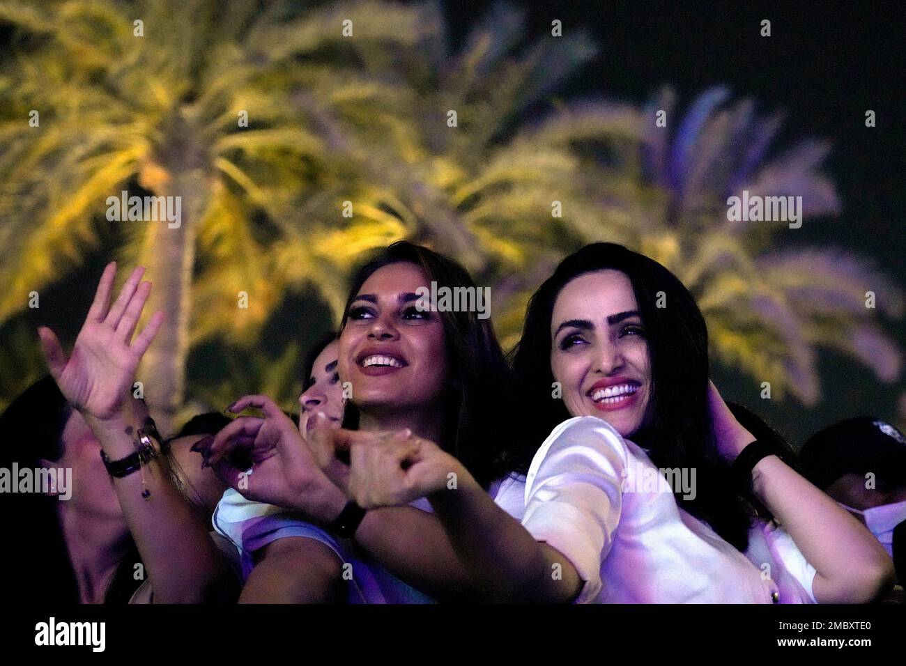Fans enjoy the Iranian pop star Googoosh's performance at the Dubai ...