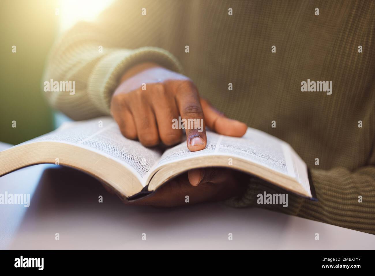 Student, finger and reading book in university library, college campus ...