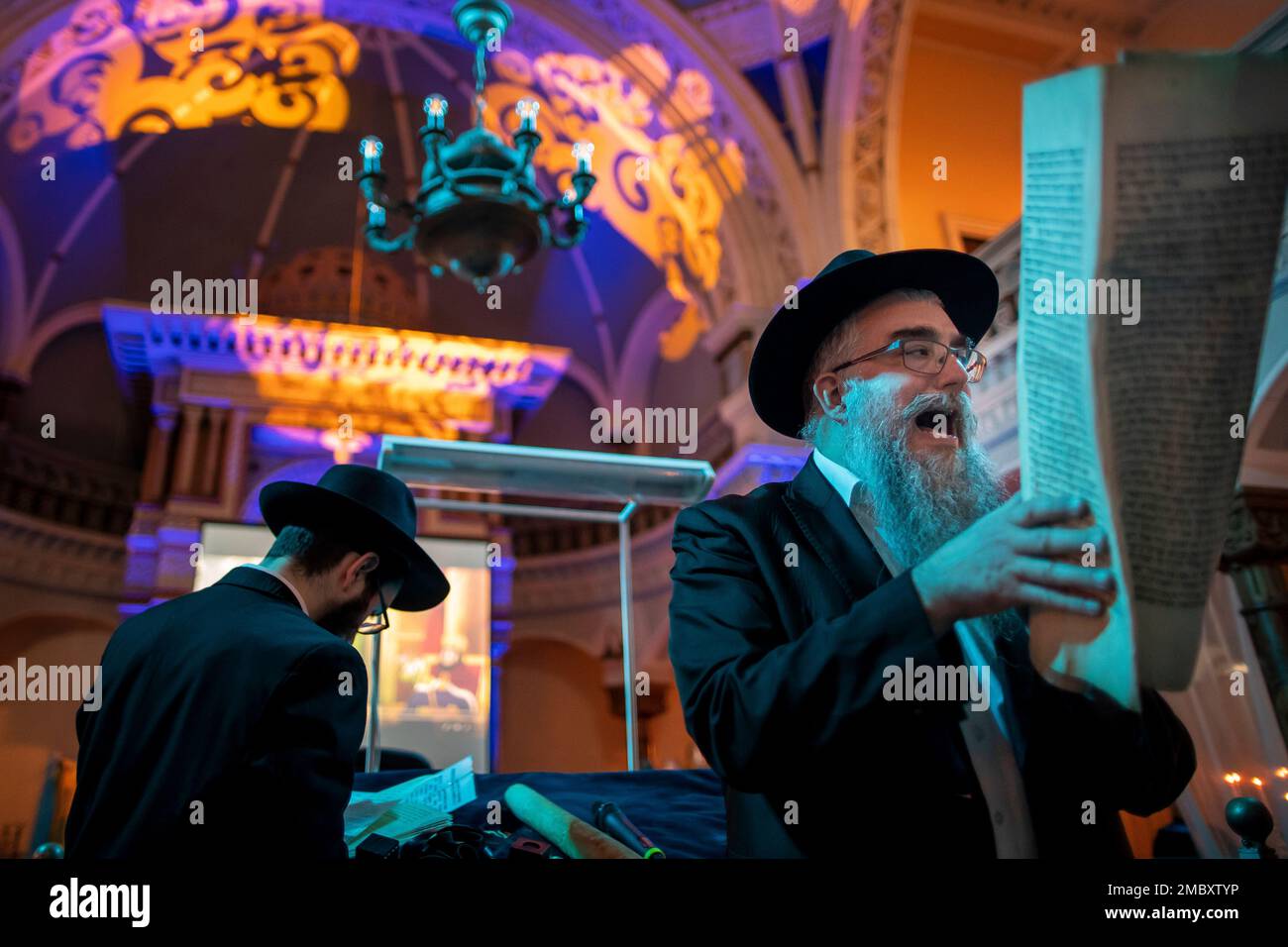 Rabbi Sholom Krinsky reads the Torah during the Jewish festival of ...