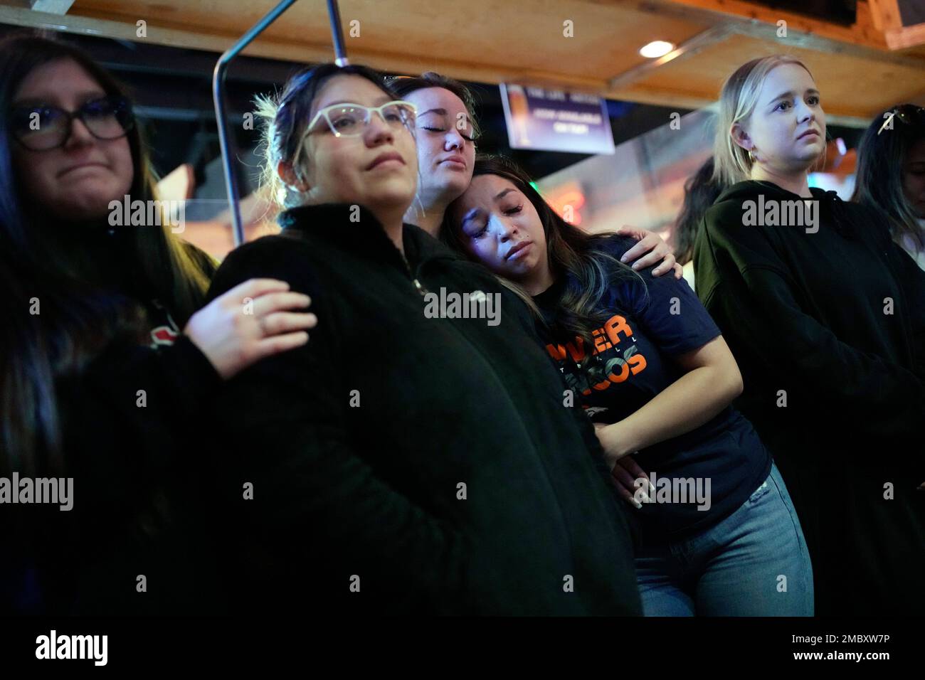 People console each other during a memorial for Jackson Zinn at a Texas ...
