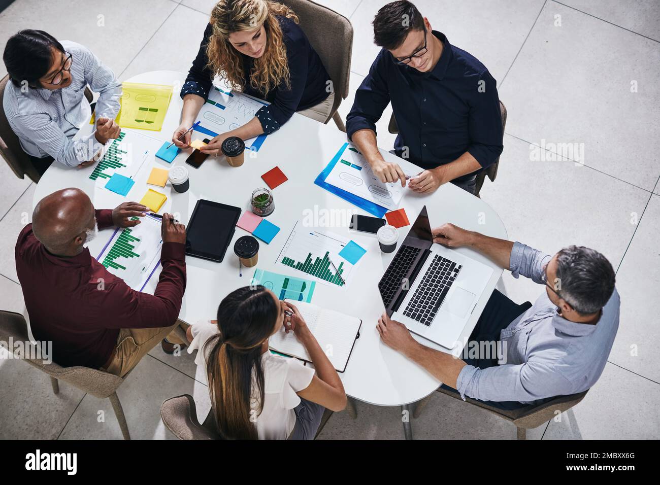 Meeting, discussion and top view of a team planning in a company report ...