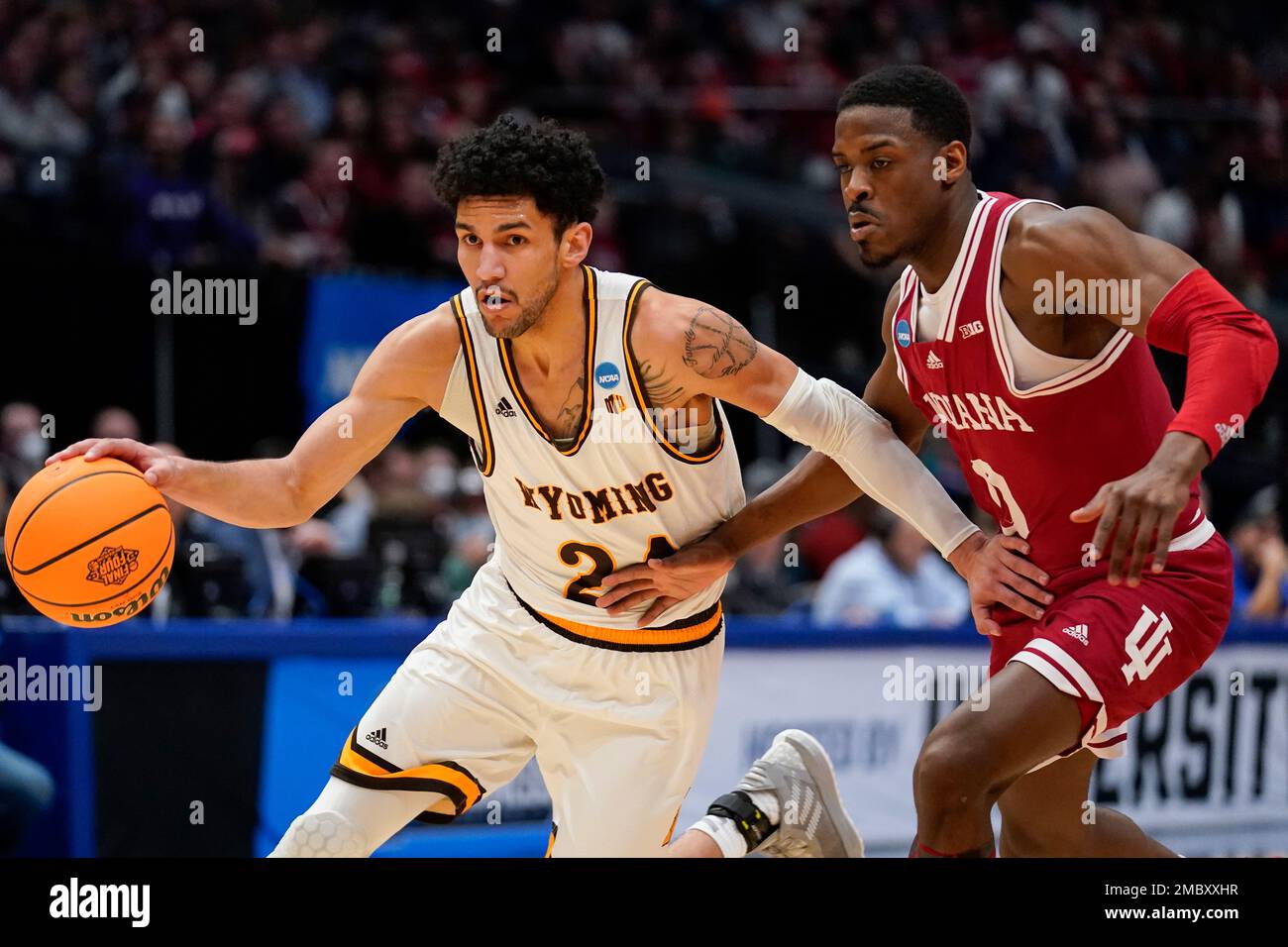 Wyoming guard Hunter Maldonado (24) drives past Indiana's Xavier ...