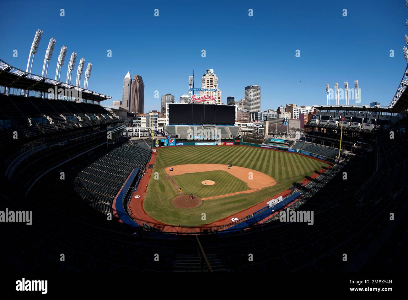 Workers finish installing the Cleveland Guardians sign above the ...
