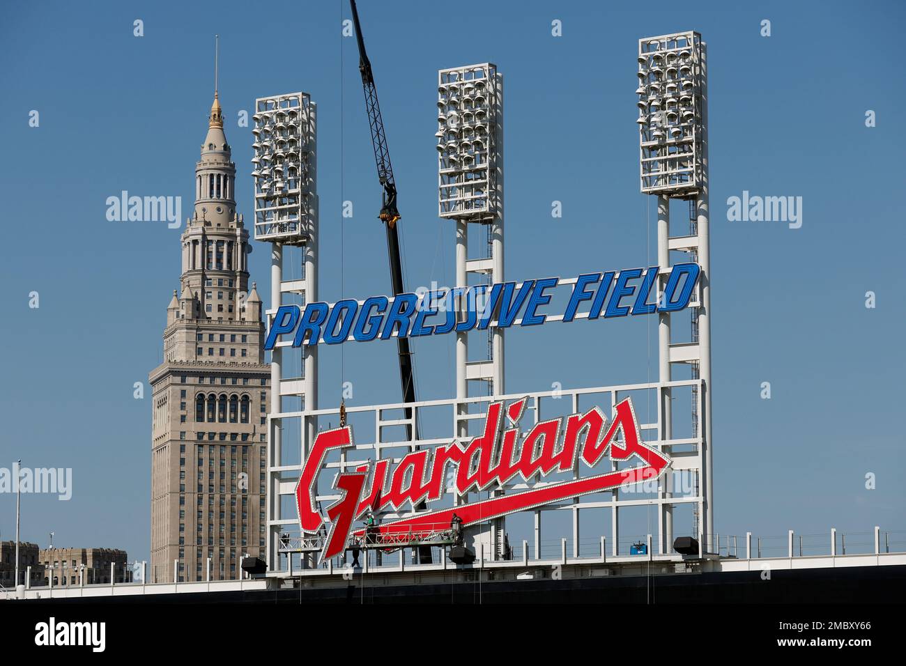 Workers finish installing the Cleveland Guardians sign above the ...