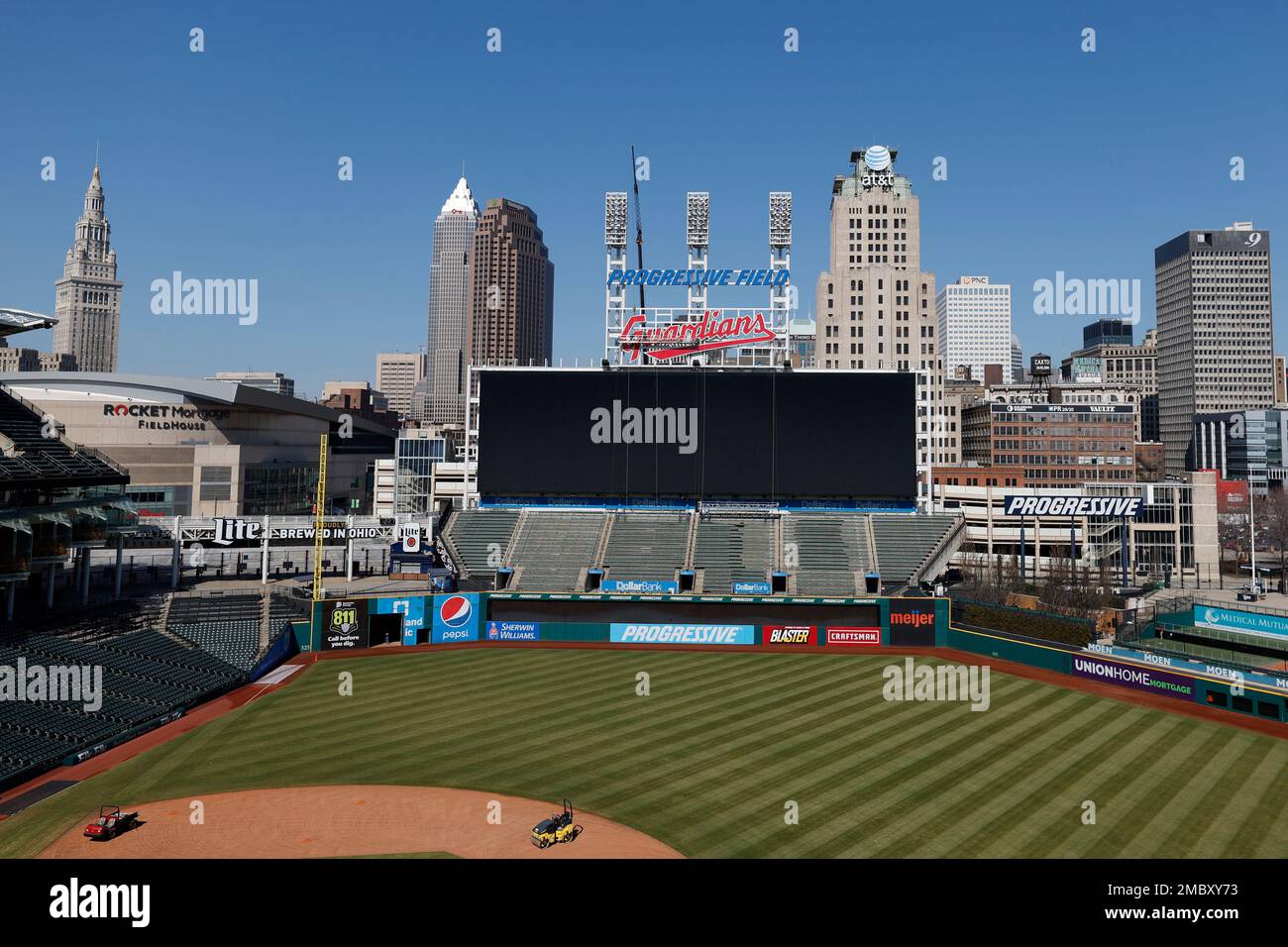 Workers finish installing the Cleveland Guardians sign above the ...