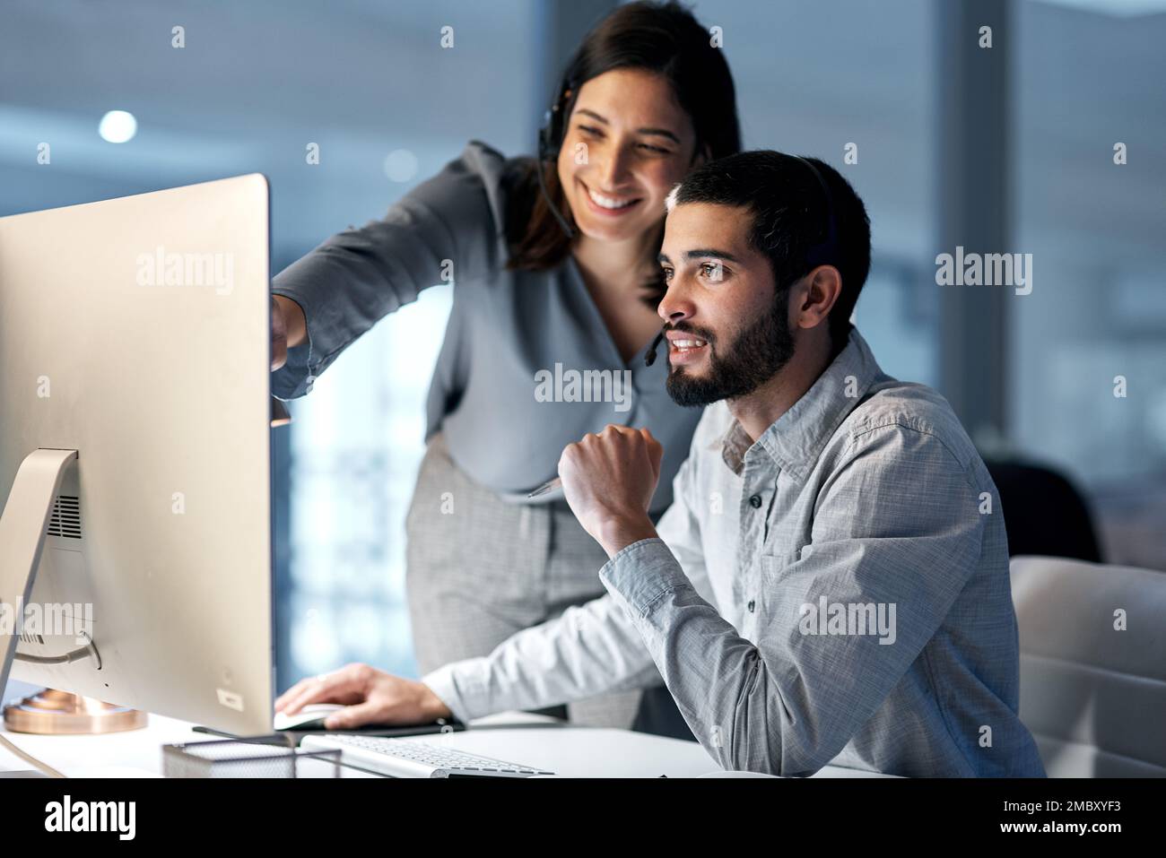 Helping colleague hi-res stock photography and images - Alamy