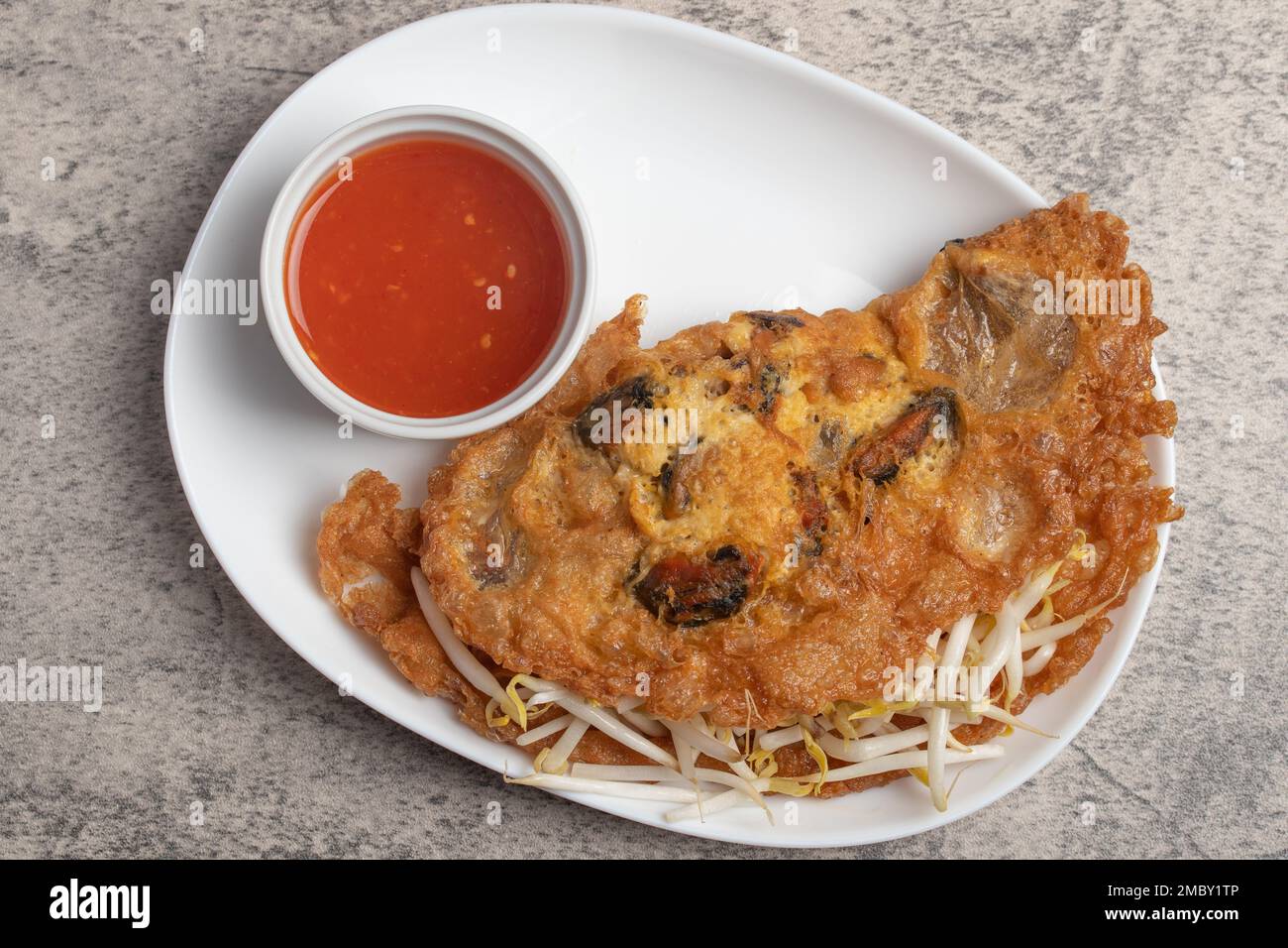 Fried mussels in crispy batter in a white plate Stock Photo - Alamy