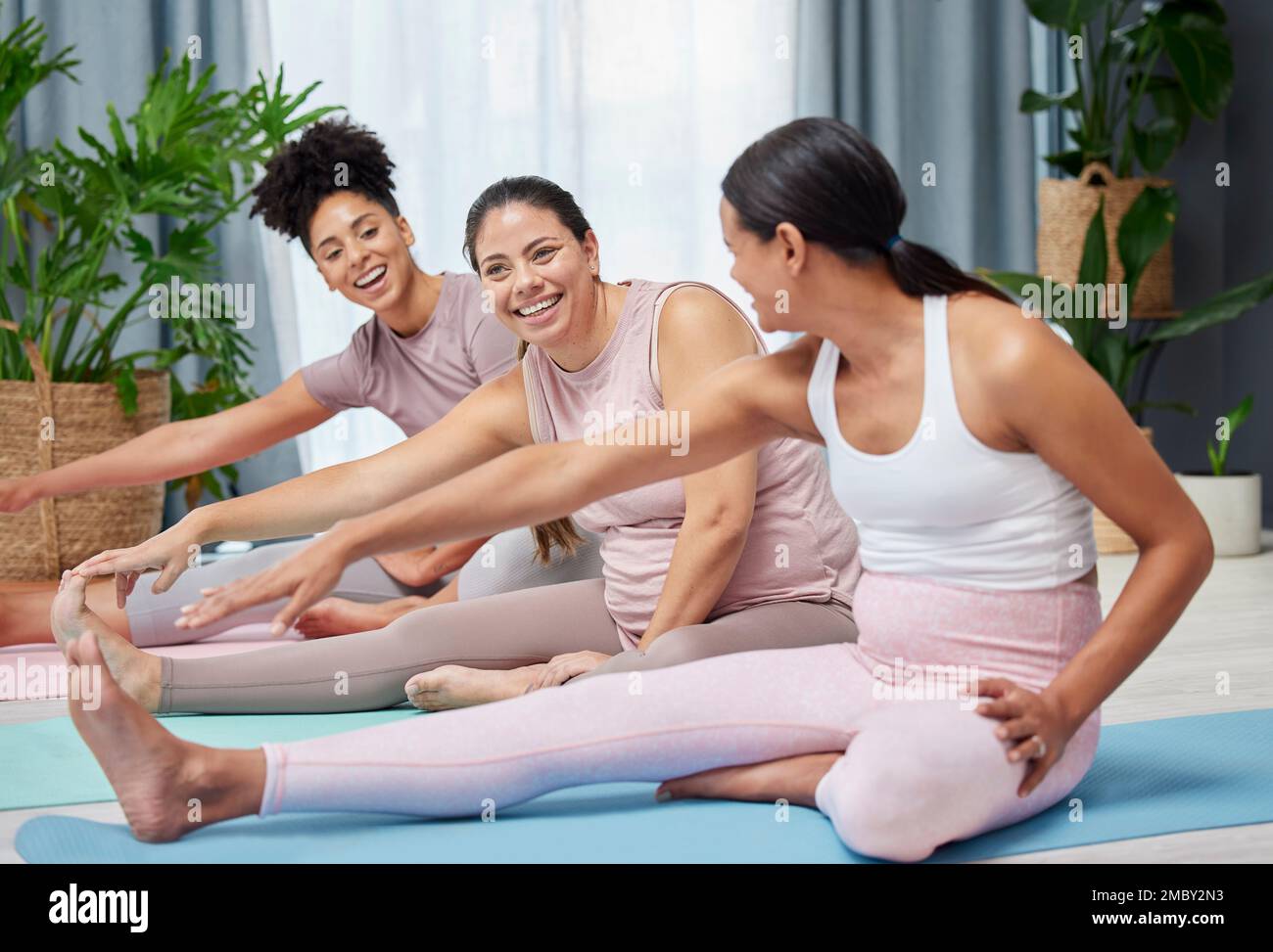 Friends, pregnant yoga and leg stretch on floor for health, wellness ...