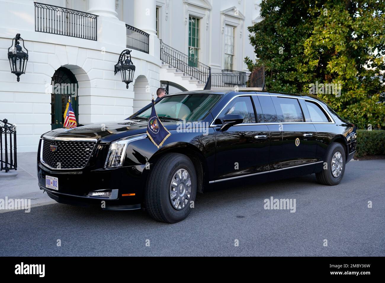 A presidential state car, also known as "the Beast," idles outside the ...