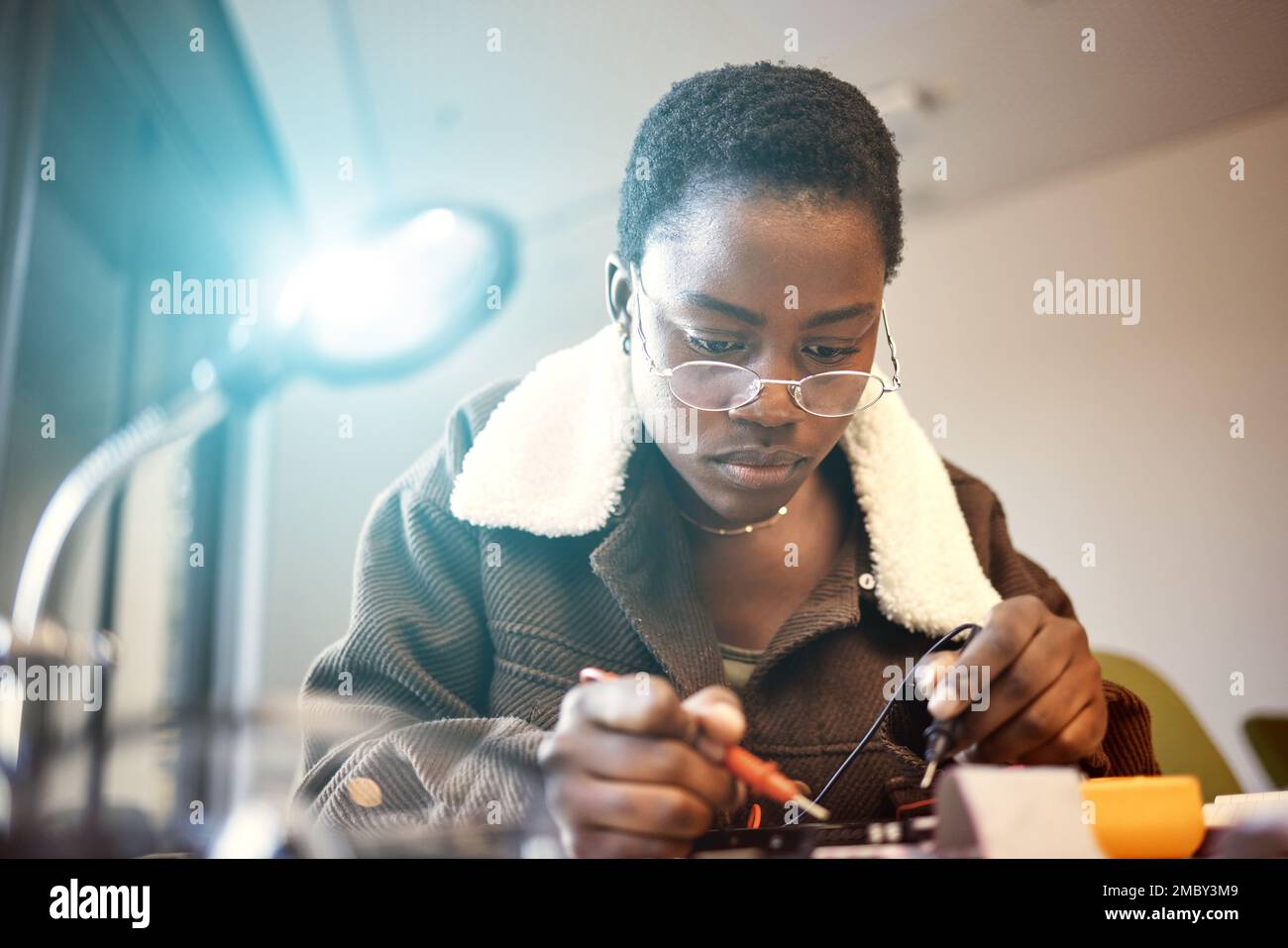 Black woman, student and engineer with electrical project while ...