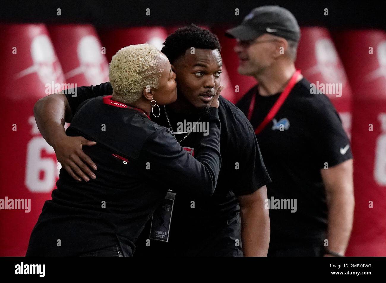 Nakobe Dean is greeted by his mother, Neketta Dean, left, during ...