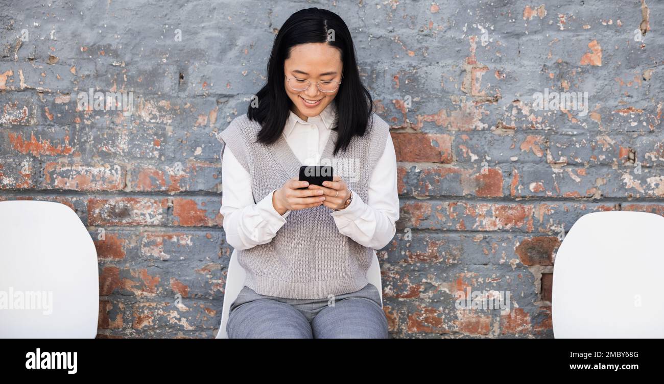 Woman texting, waiting for interview on chairs and typing on phone ...