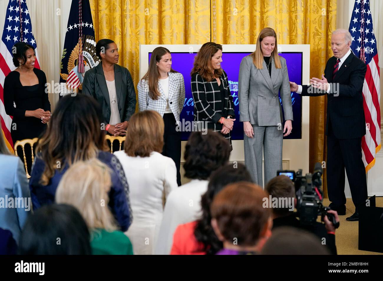 President Joe Biden invites onstage from left, Margaret 'Midge' Purce ...