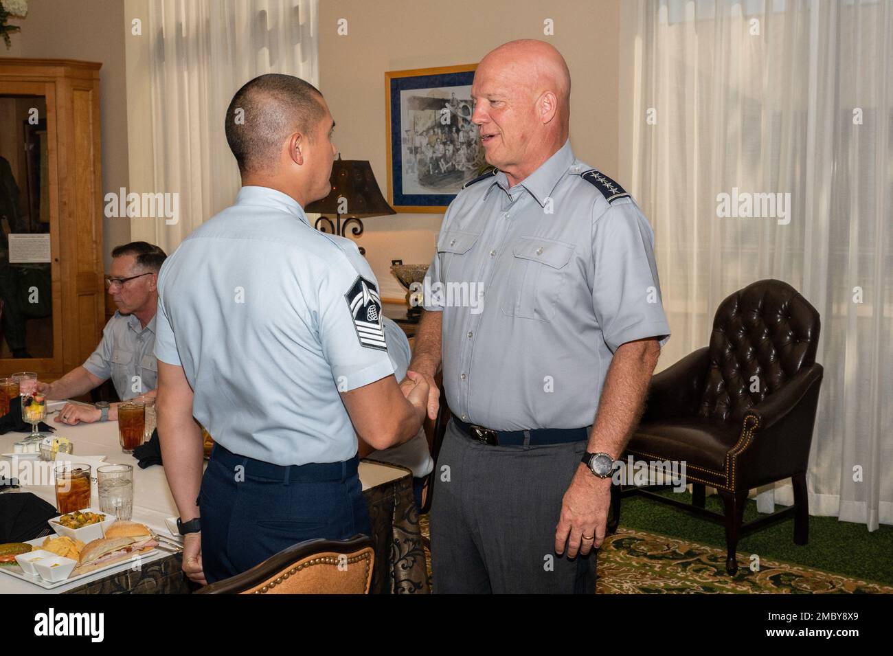Chief of Space Operations Gen. John W. “Jay” Raymond presents a coin to ...