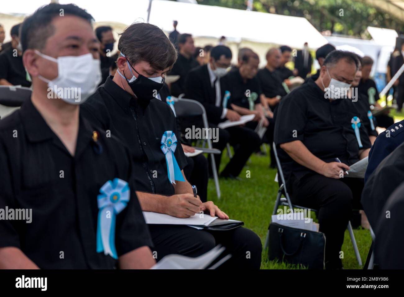U.S. Consul General Matthew Dolbow, takes notes during the 2022 ...